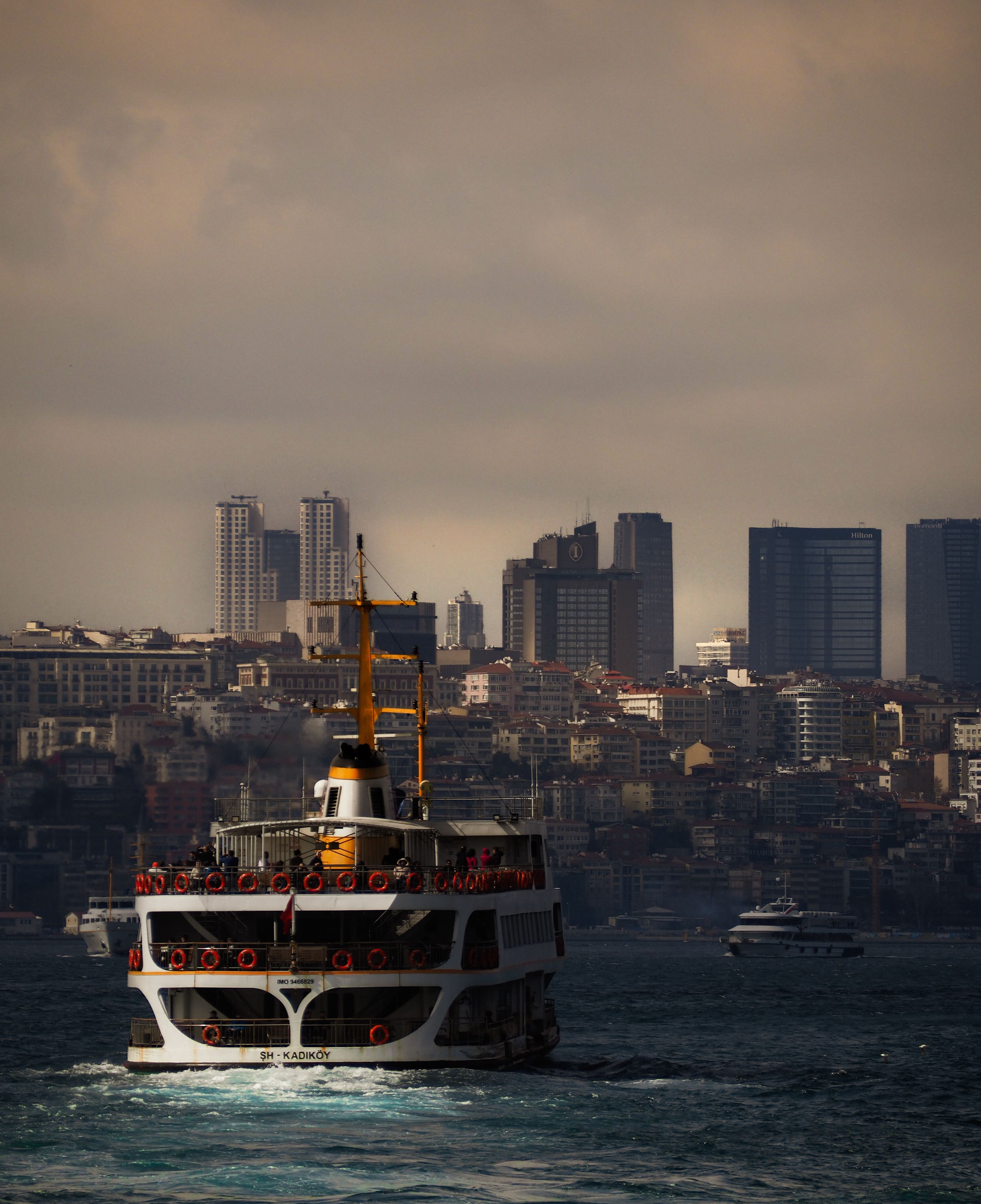 Photo of a Ferry with a View of a Suspension Bridge · Free Stock Photo