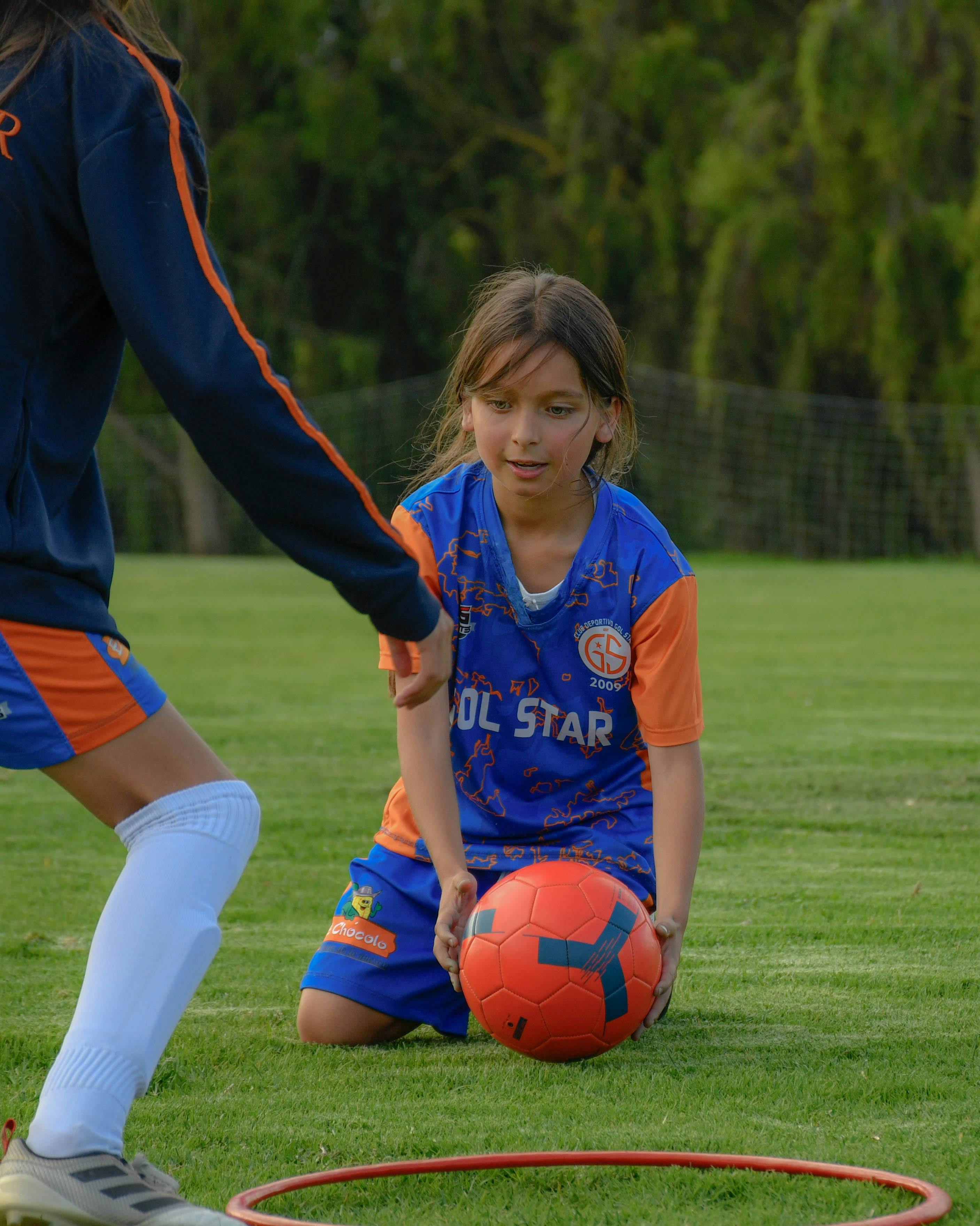 Girl Practicing Football · Free Stock Photo