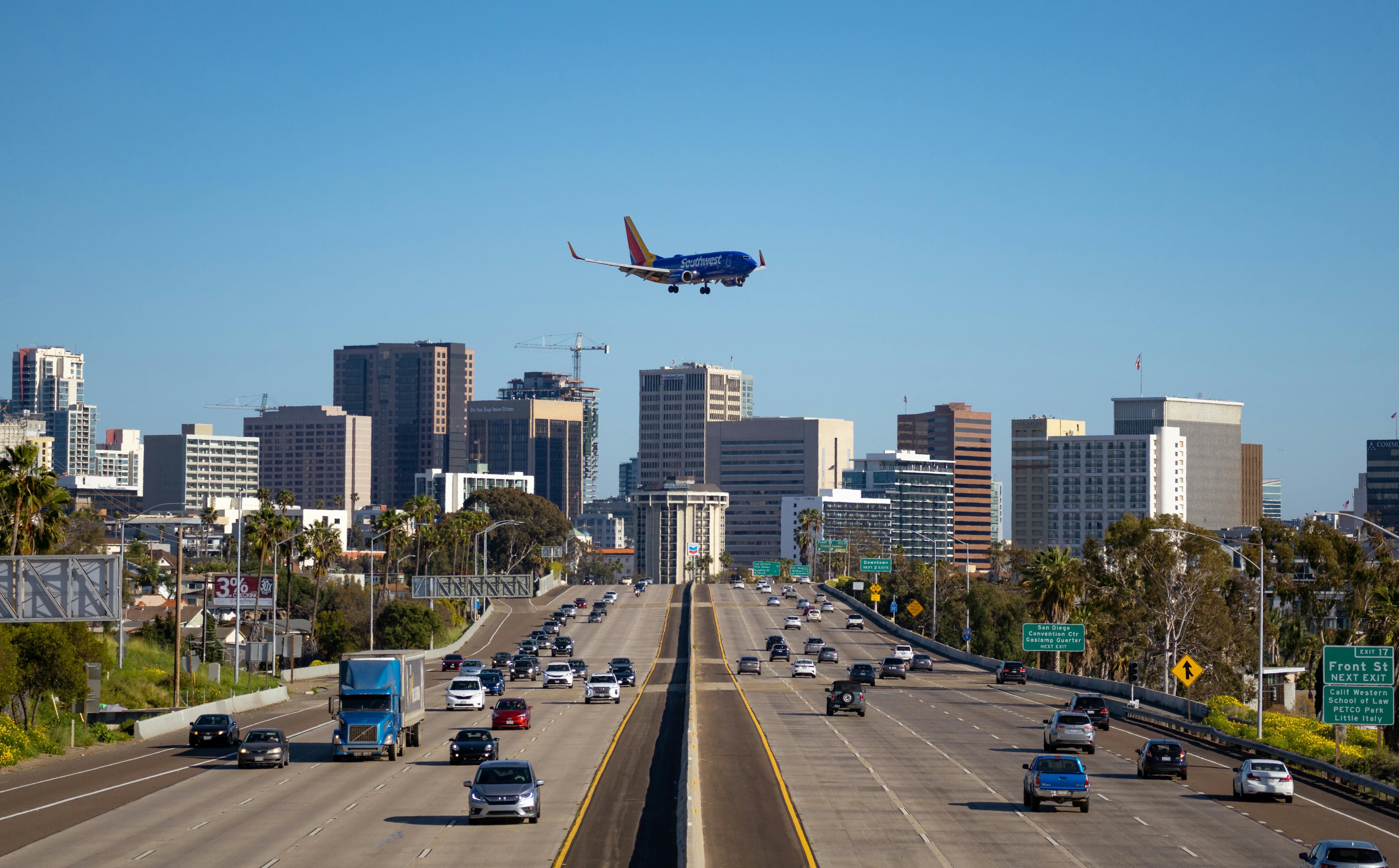 Plane over a Freeway · Free Stock Photo