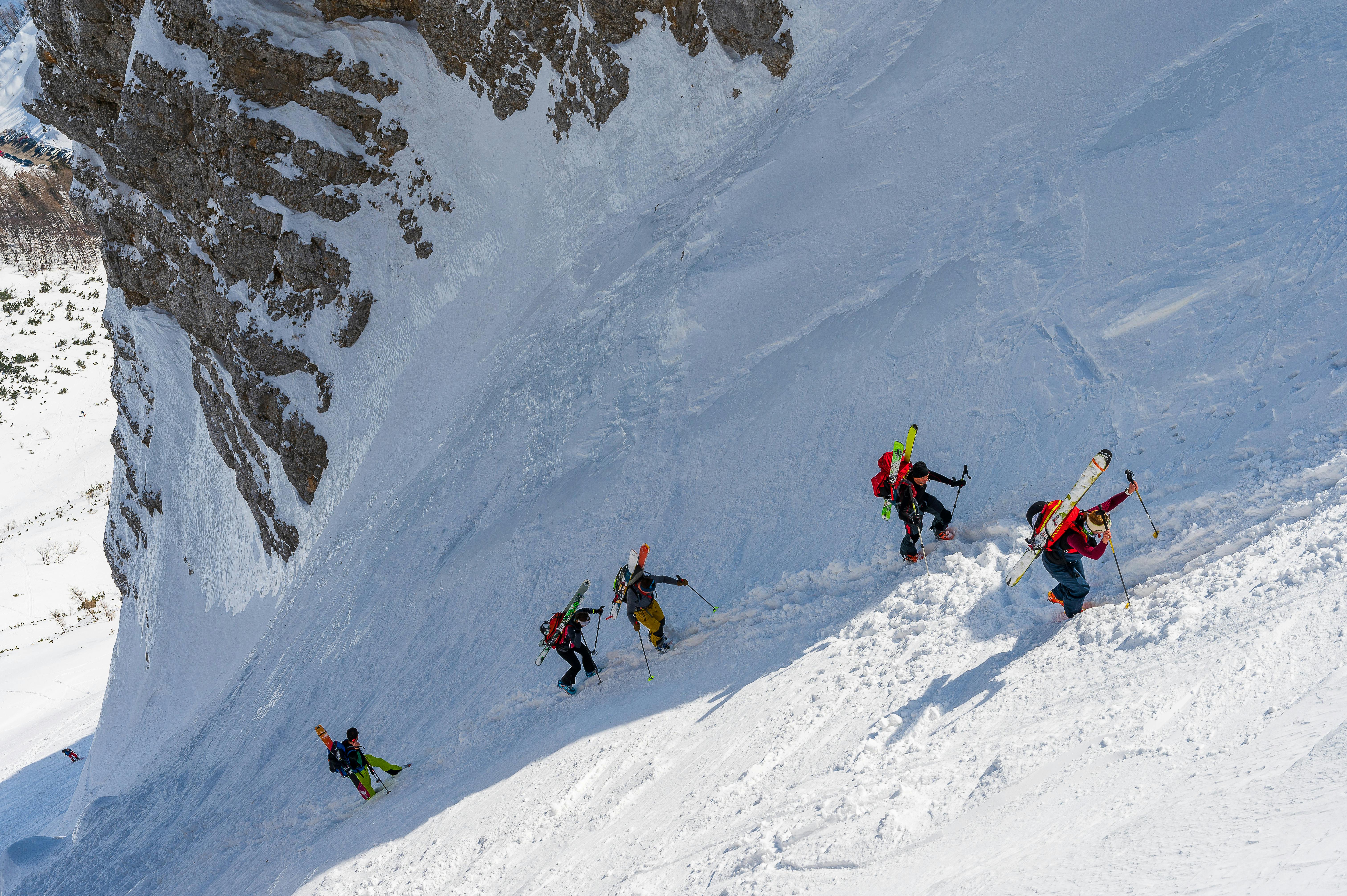 People Climbing a Mountain in Winter · Free Stock Photo