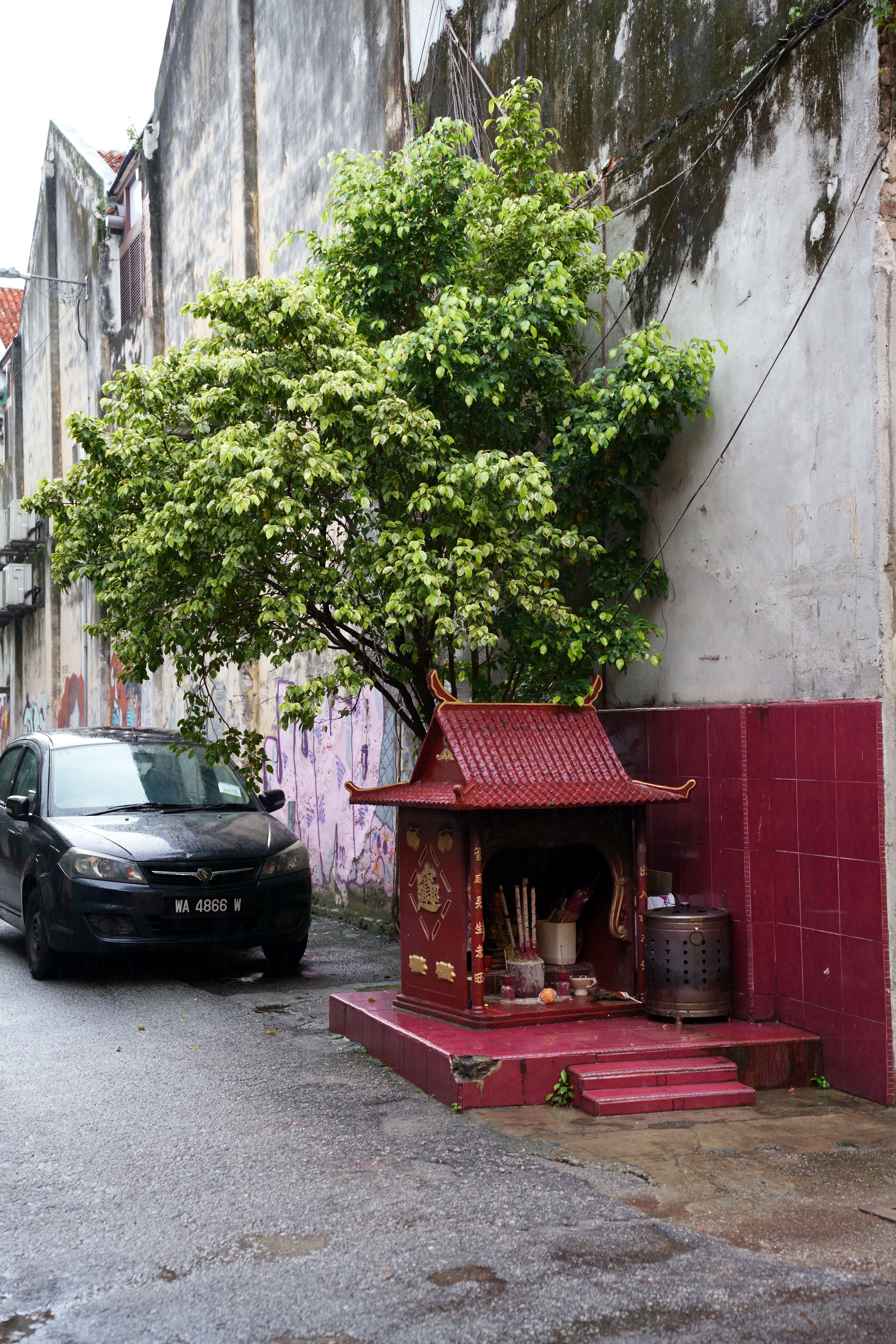 Miniature Shrine near Wall · Free Stock Photo