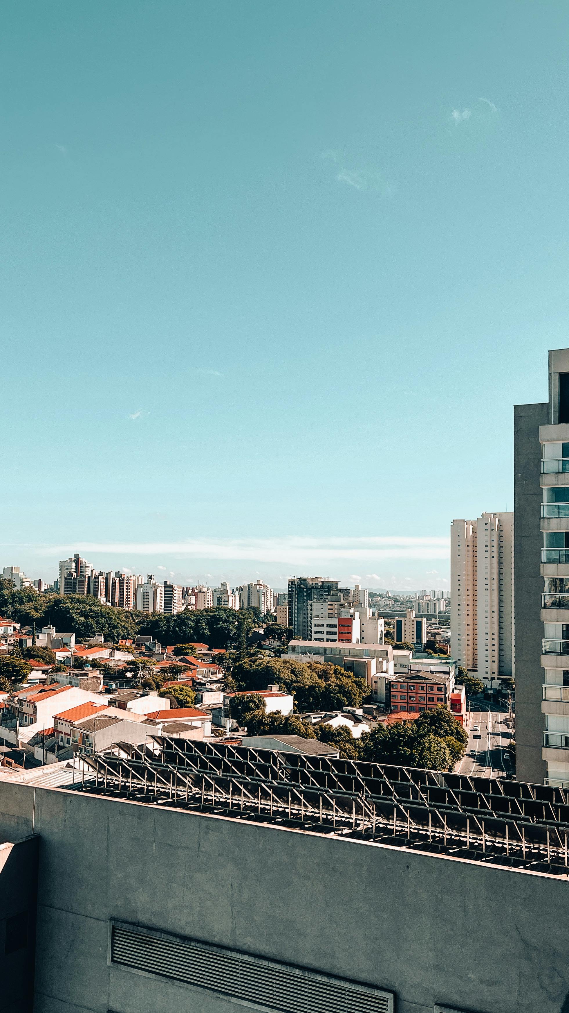 Clear Sky over Buildings in City · Free Stock Photo