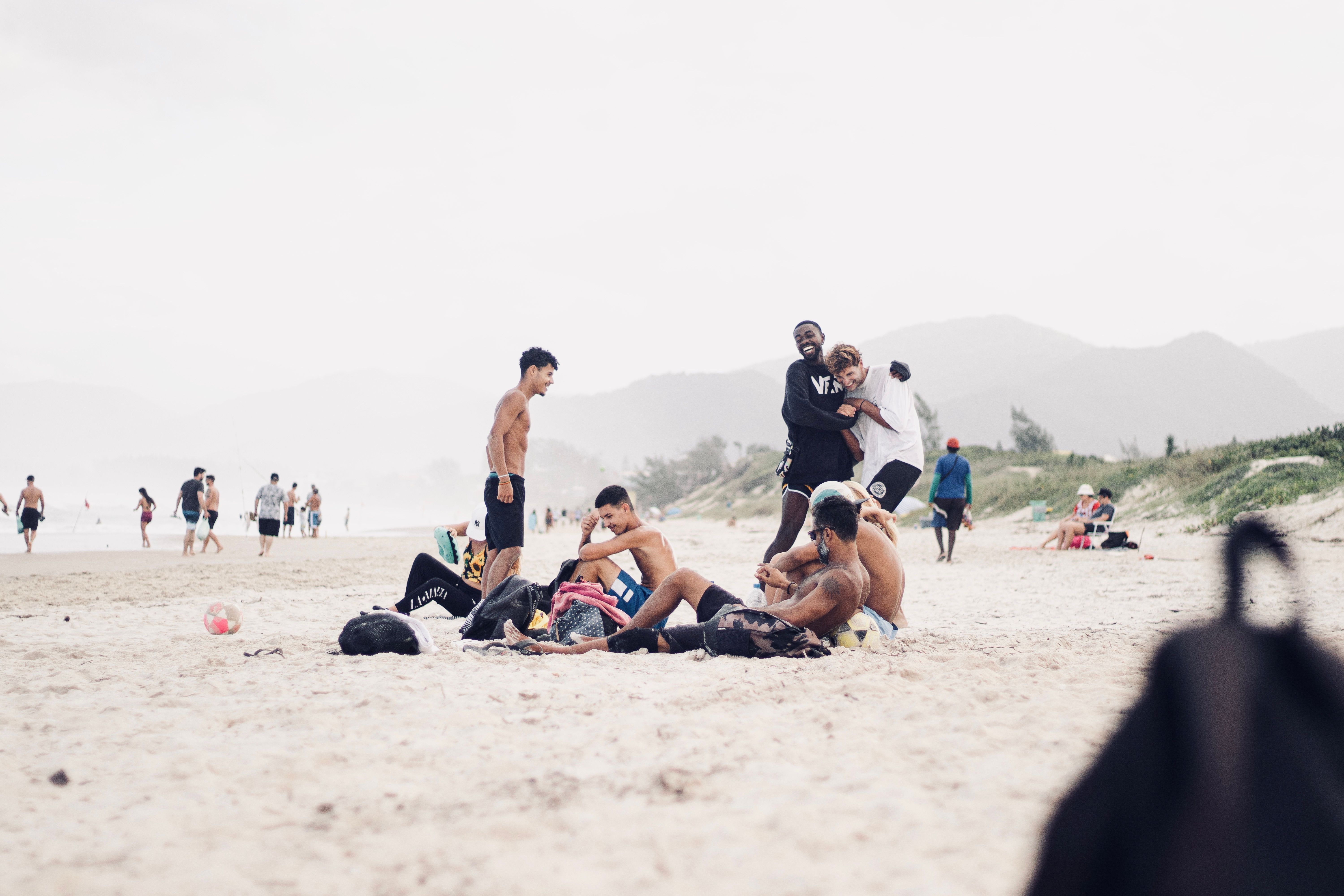 A Group of Men on the Beach · Free Stock Photo