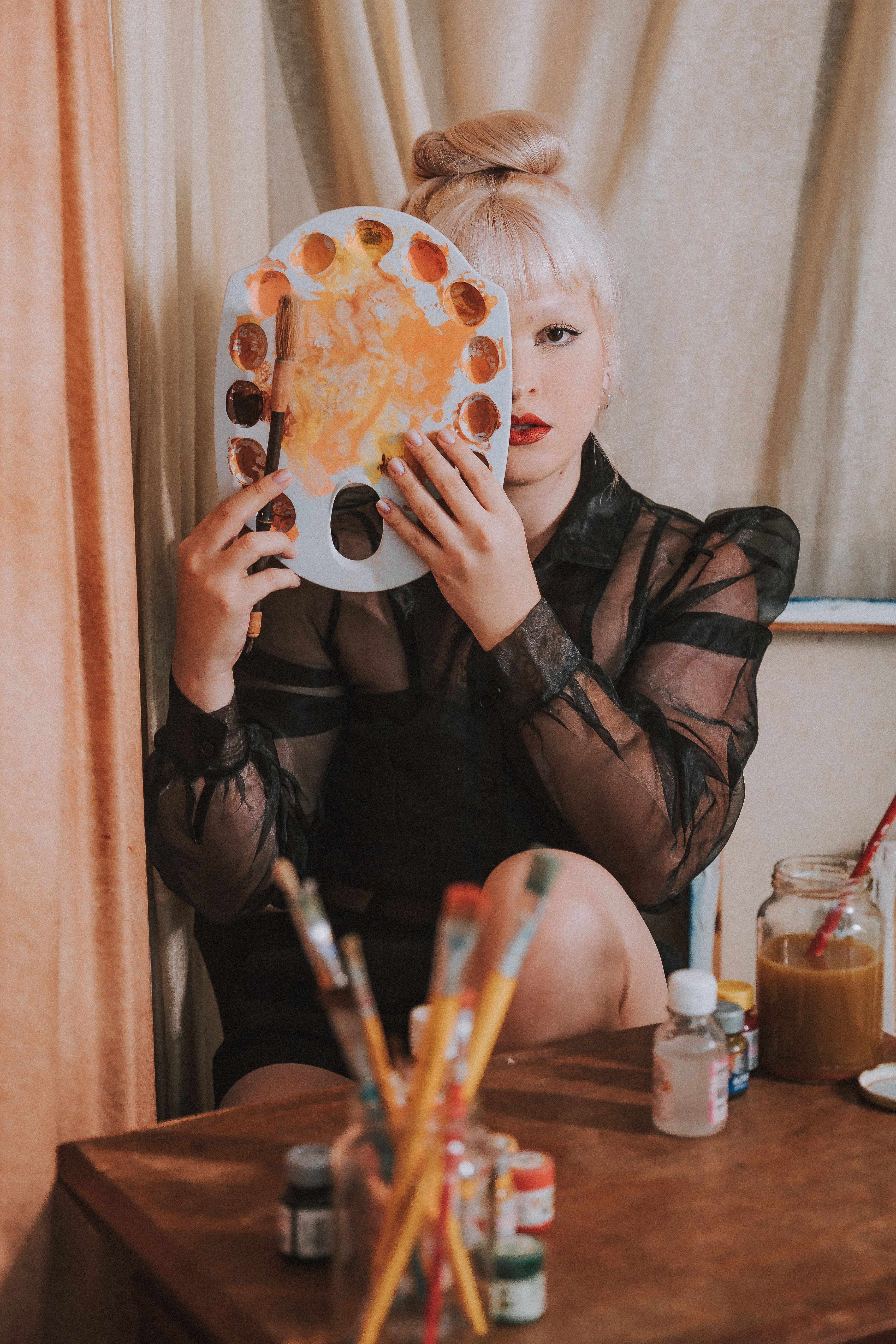 Portrait of a Pretty Blonde Holding an Artists Palette · Free Stock Photo