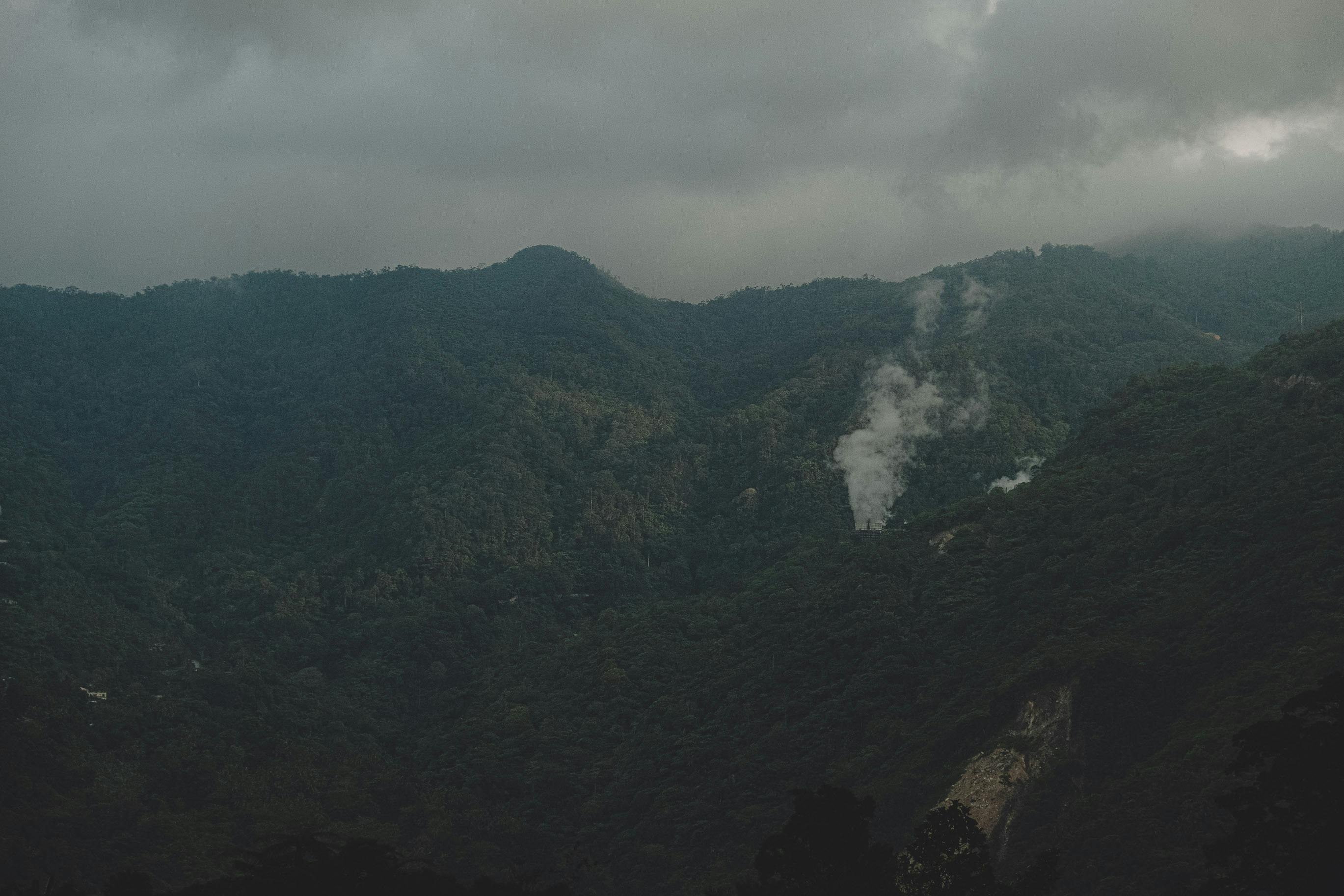 Smoke Rising over Mountain Forest · Free Stock Photo