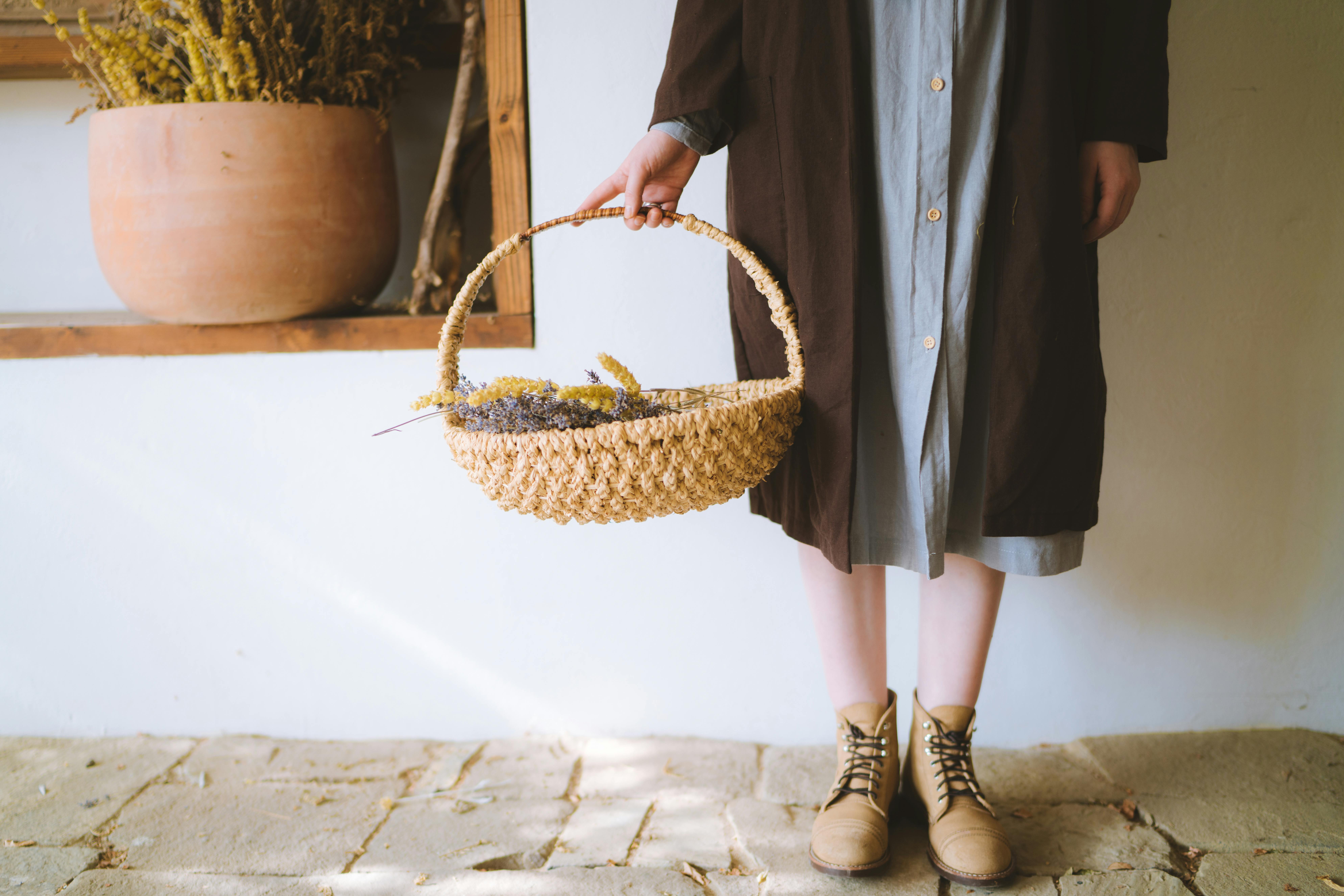 Woman Standing Holding A Basket · Free Stock Photo