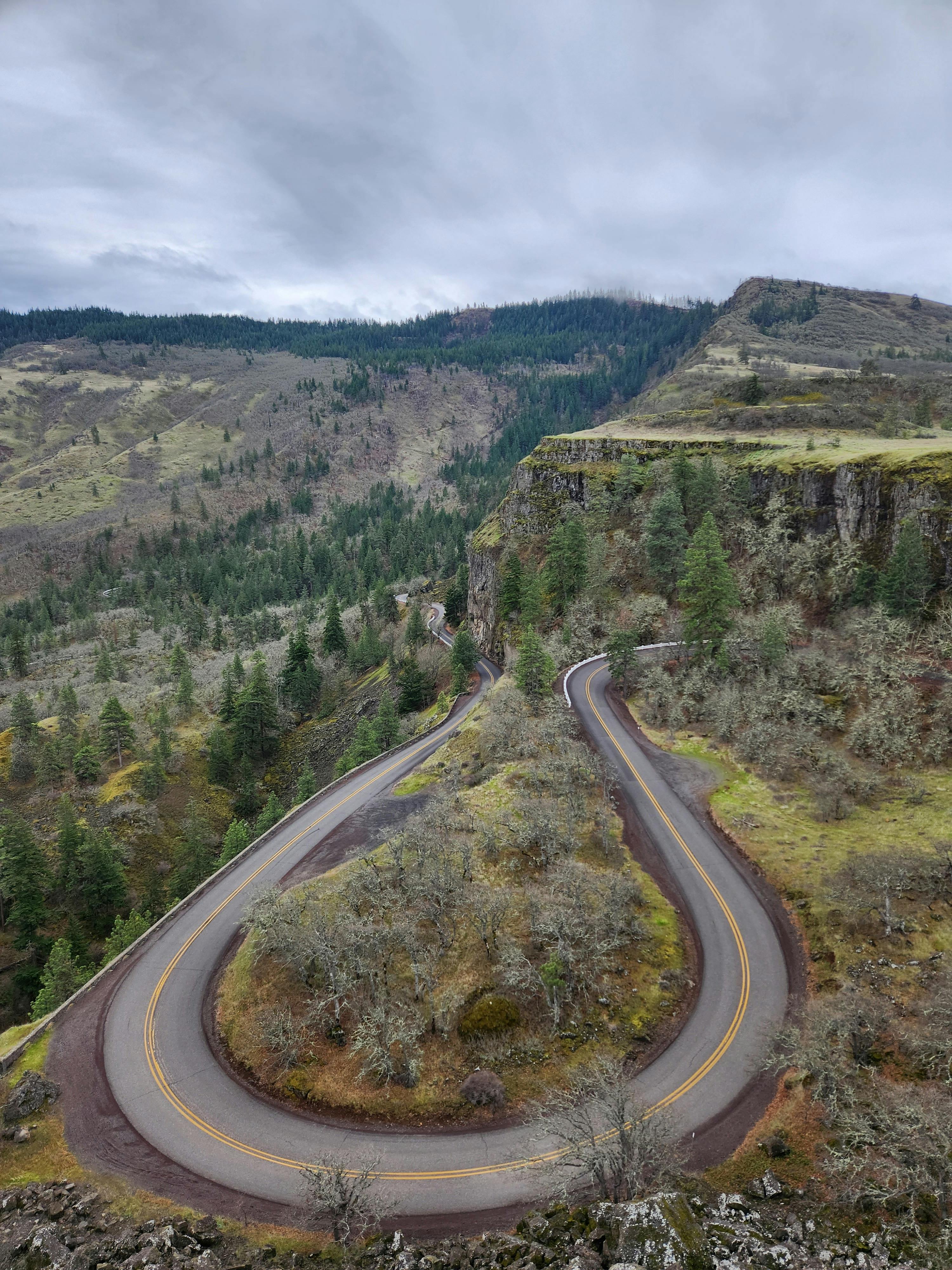 Aerial view of a Curvy Road in Mountains · Free Stock Photo