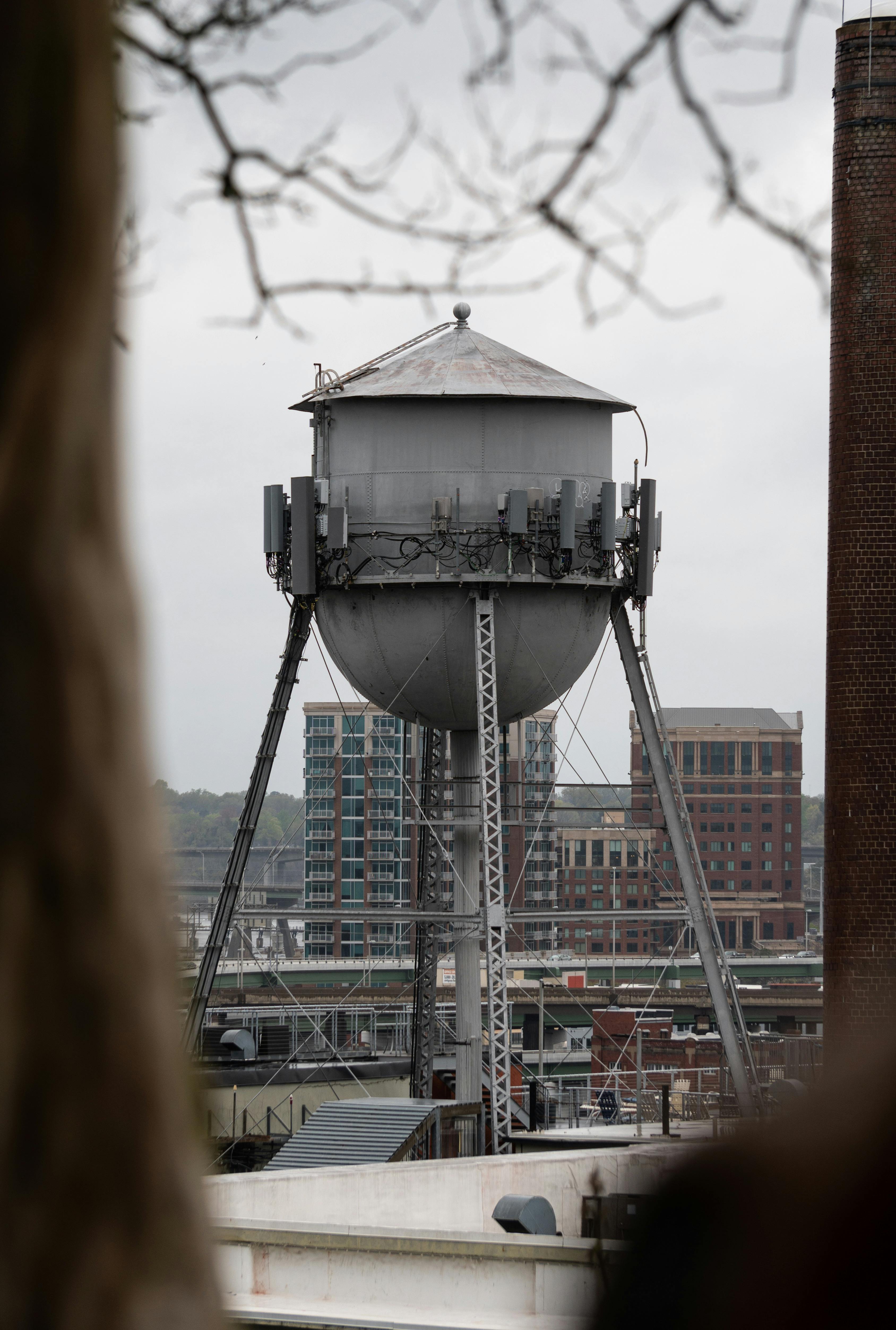 A water tower is seen in the distance · Free Stock Photo