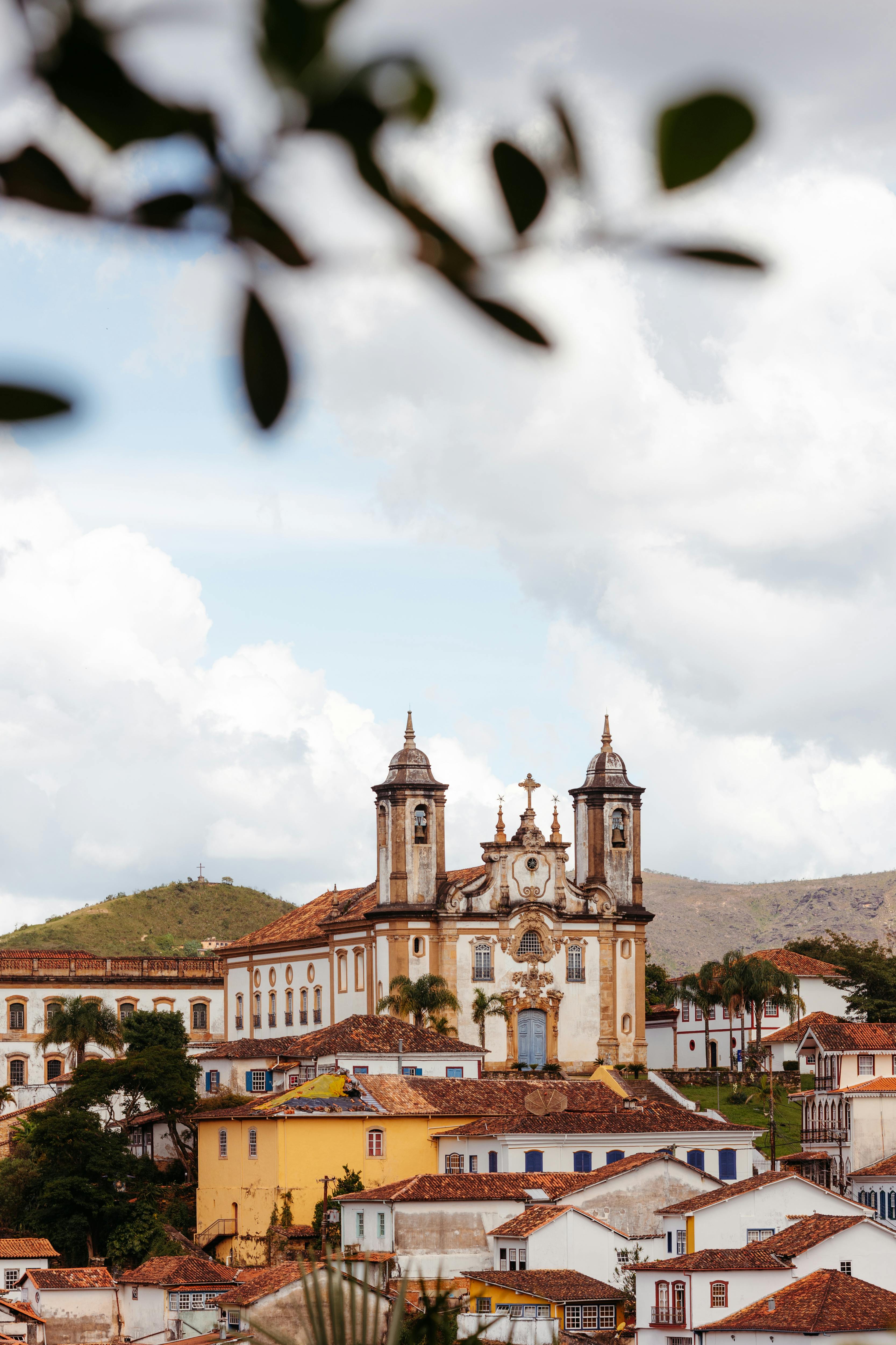 Scenic Photo of City Through Opened Window · Free Stock Photo