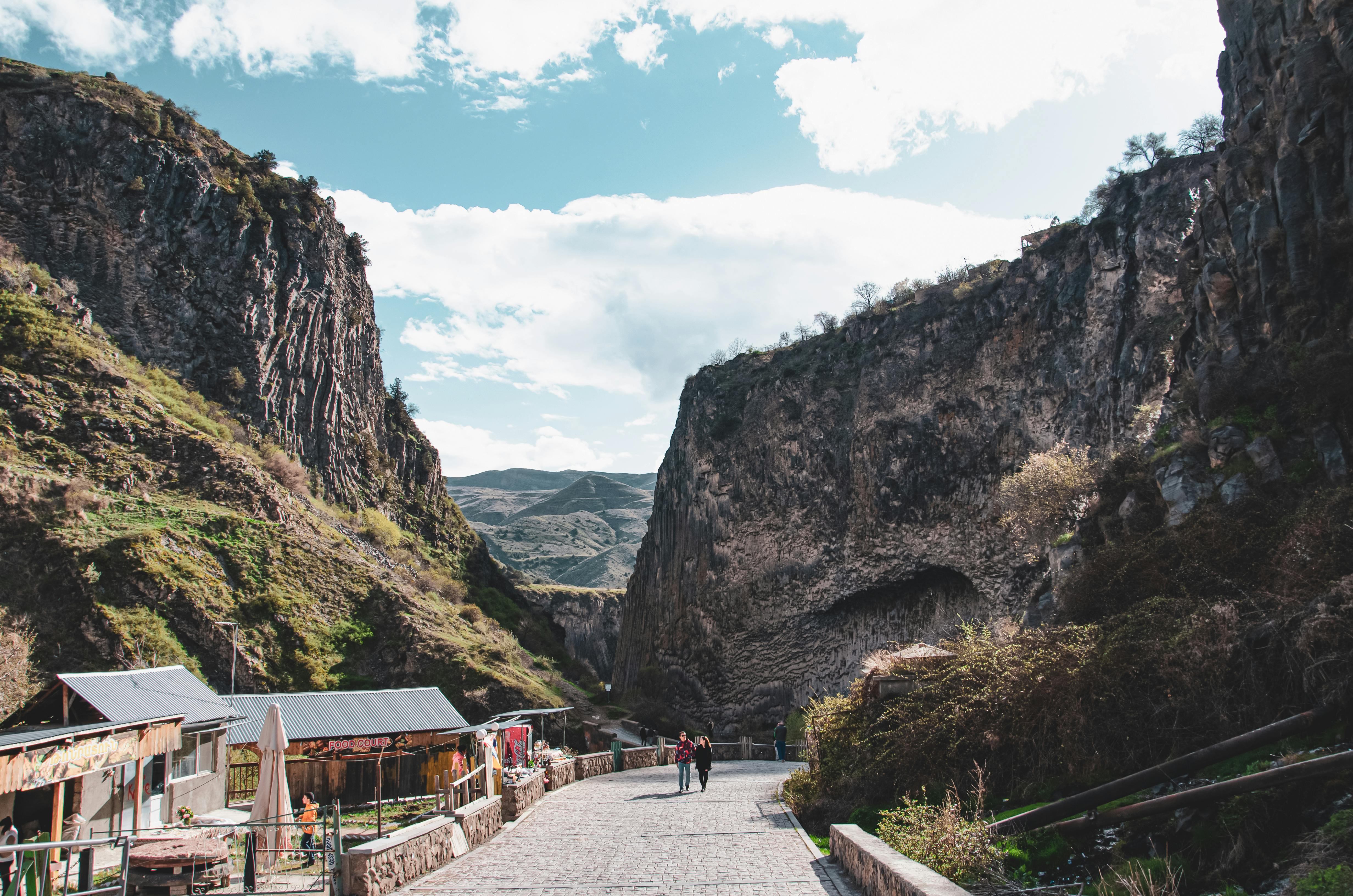 Pavement in a Valley between Cliffs · Free Stock Photo