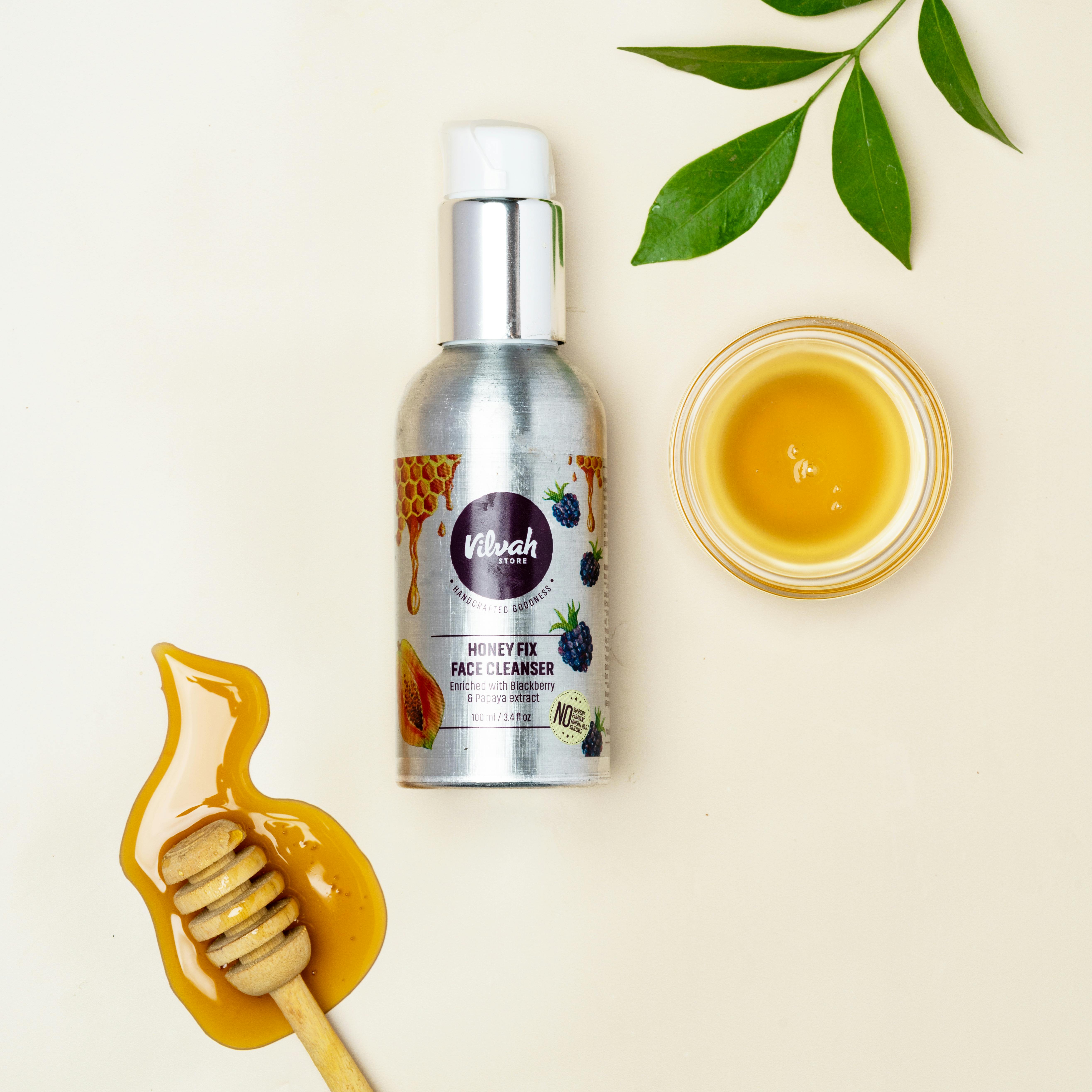 A Teaspoonful of Honey over the Bottle · Free Stock Photo