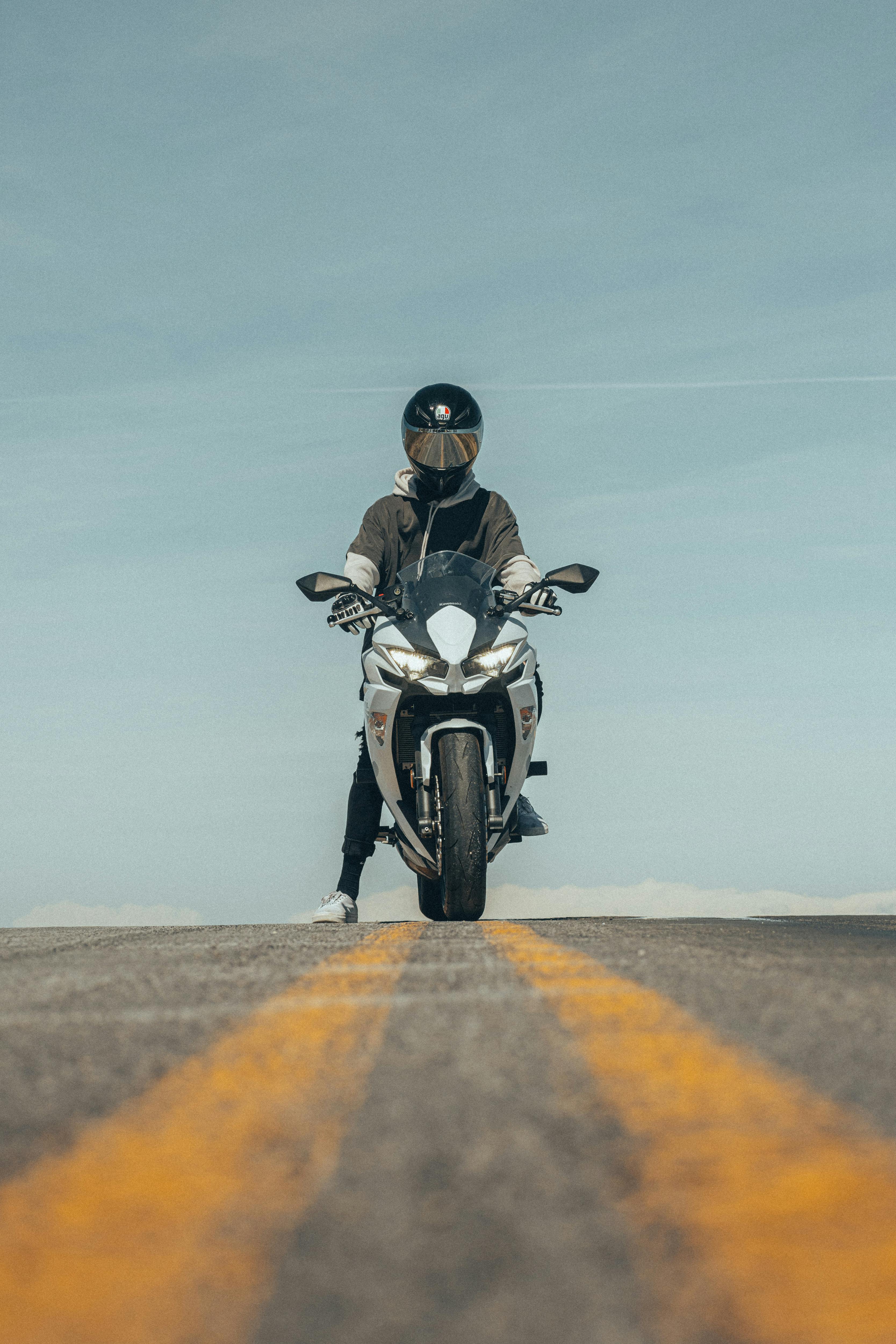 Person Riding Motorcycle during Golden Hour · Free Stock Photo