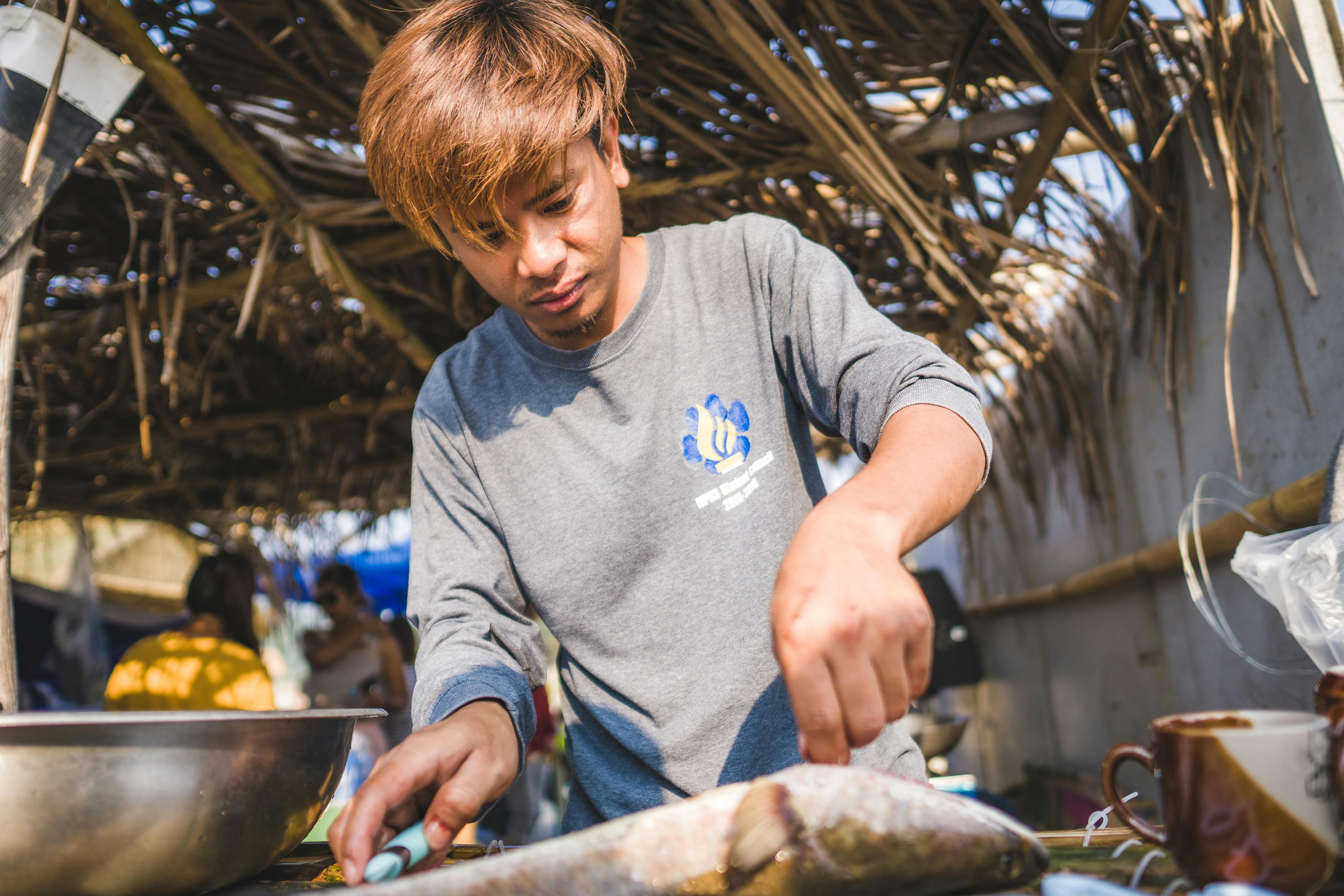 Man Cooking Fish · Free Stock Photo