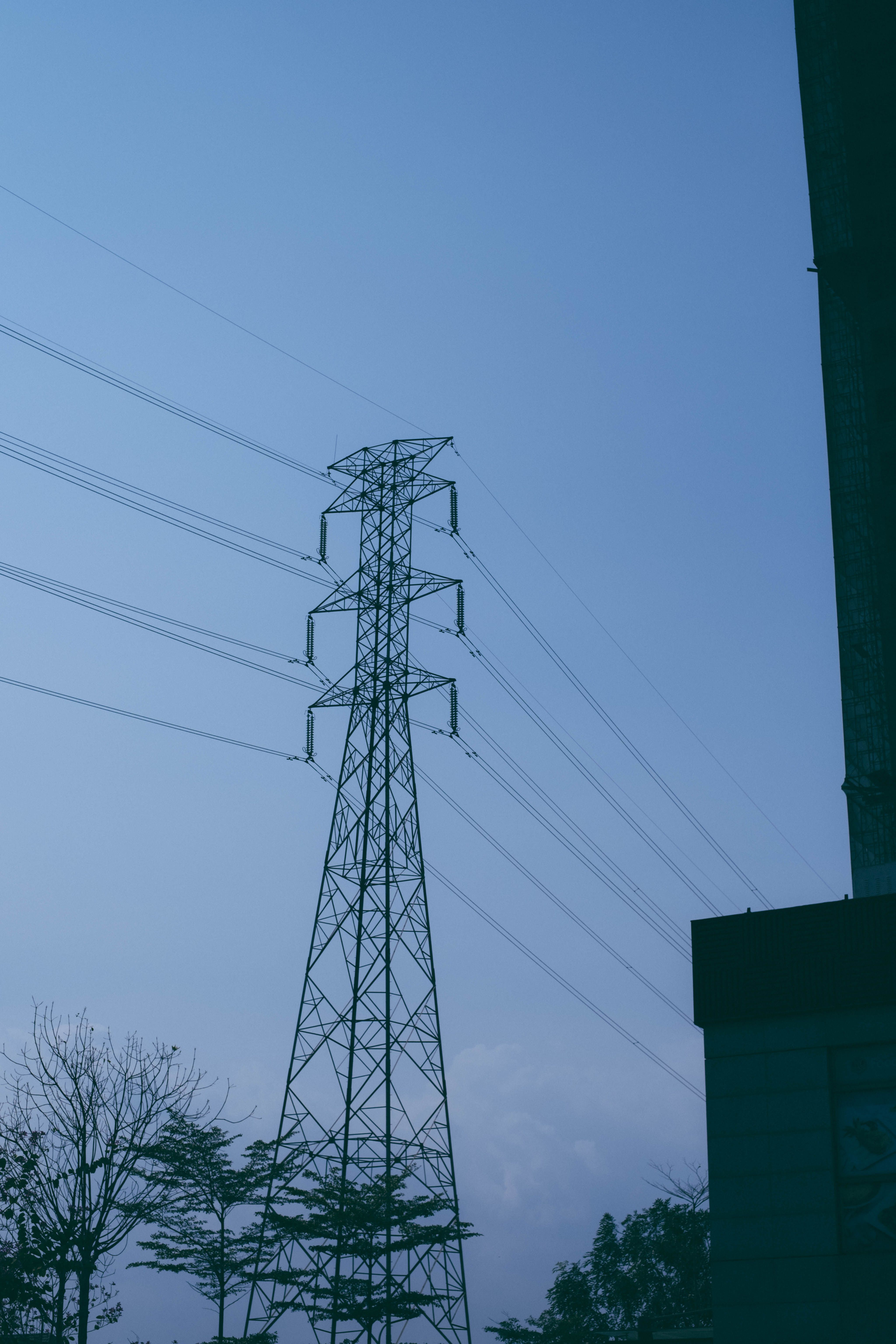 Tall Electricity Pylon Standing against the Sky · Free Stock Photo