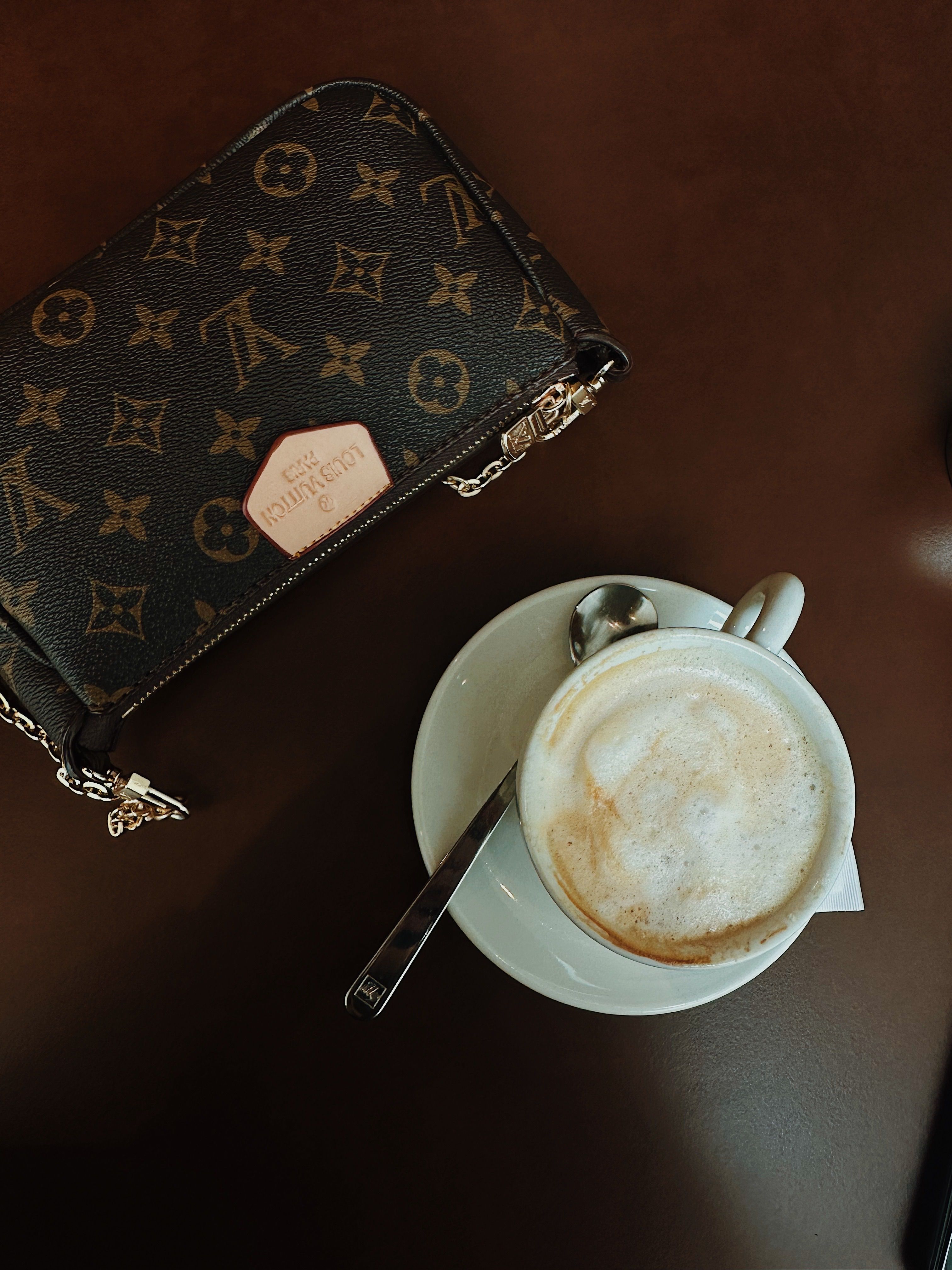 Photo of a Cup of Coffee and a Handbag · Free Stock Photo
