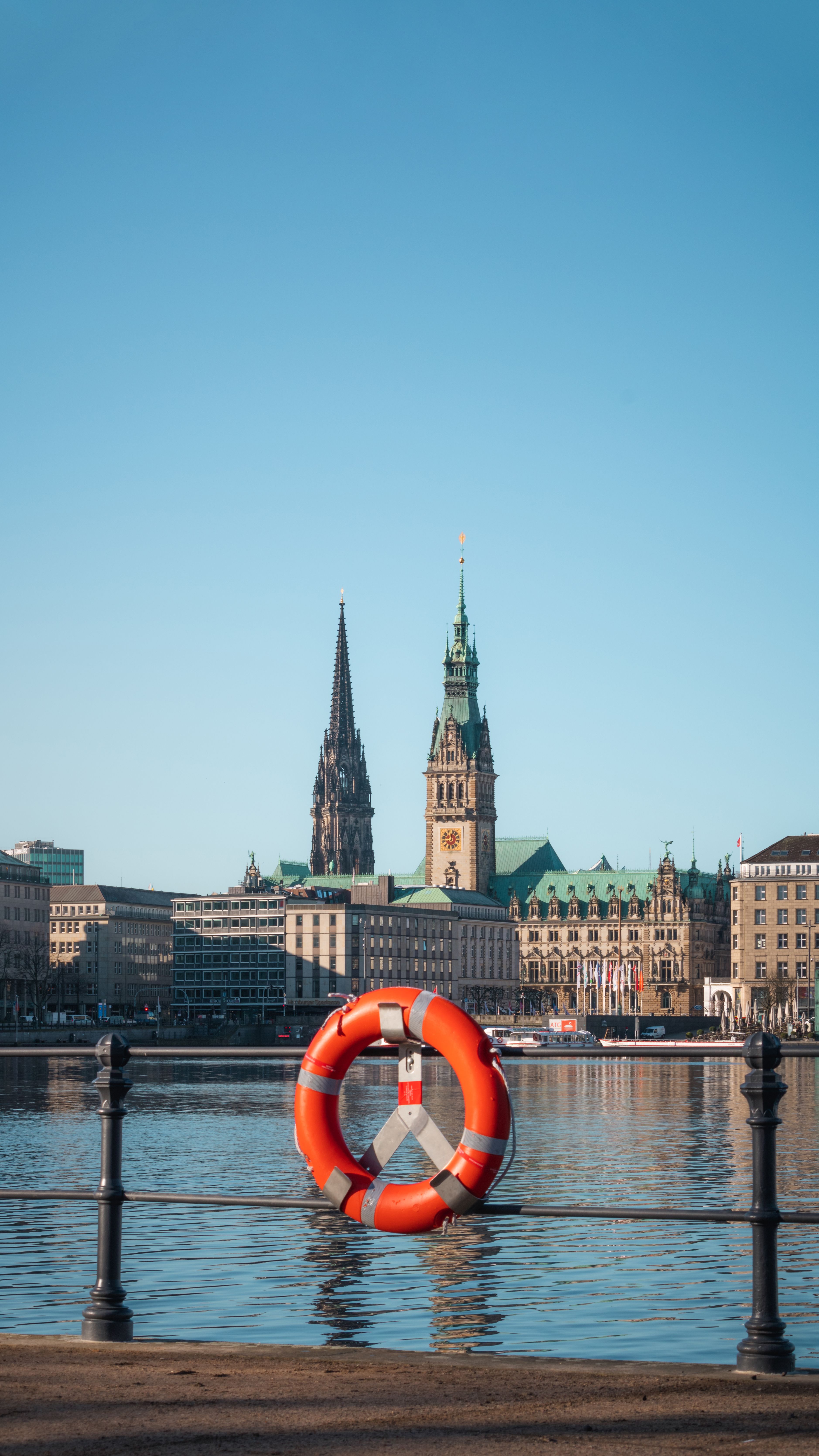 A life preserver on a dock in front of a church · Free Stock Photo