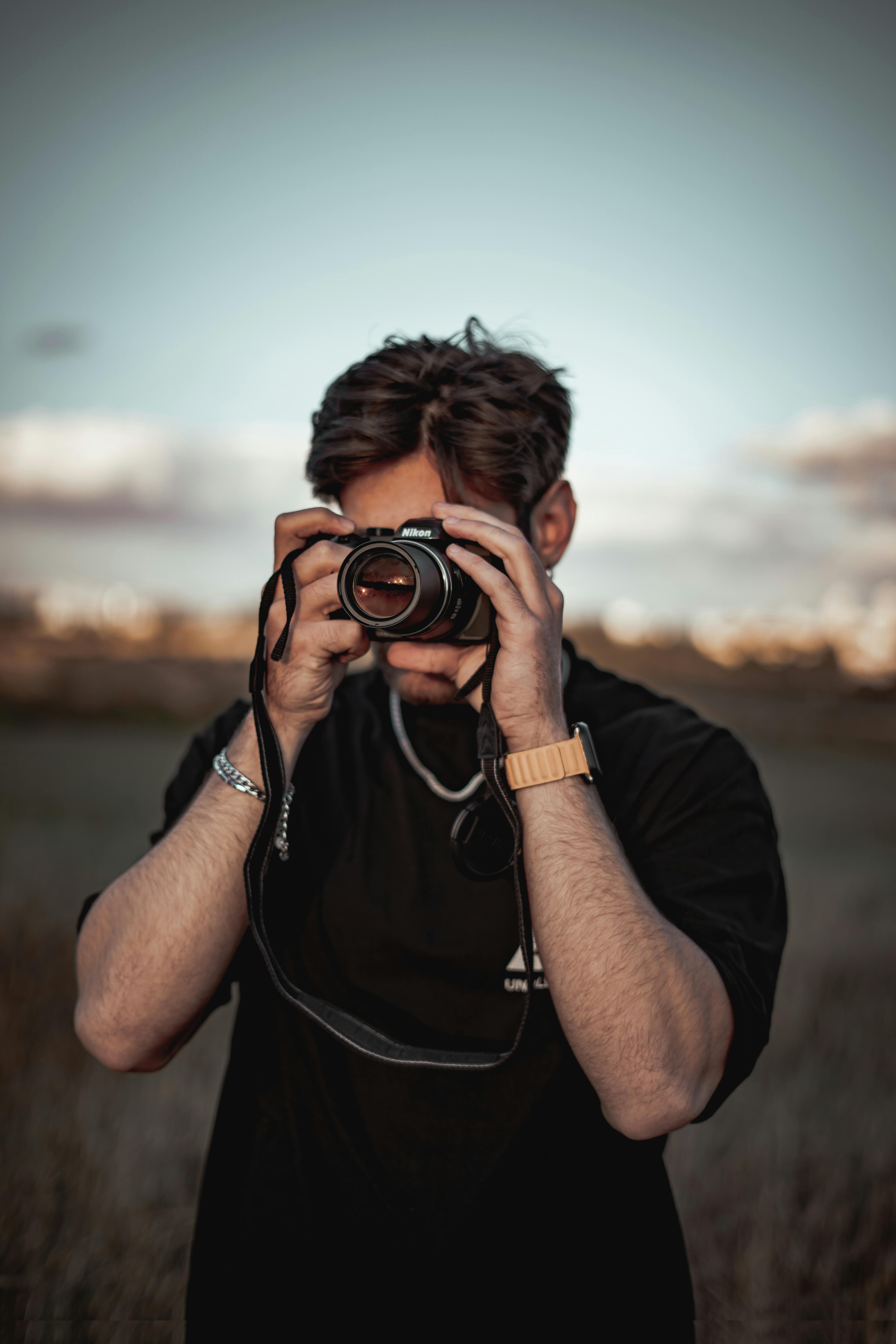 Man Taking Pictures with Camera · Free Stock Photo