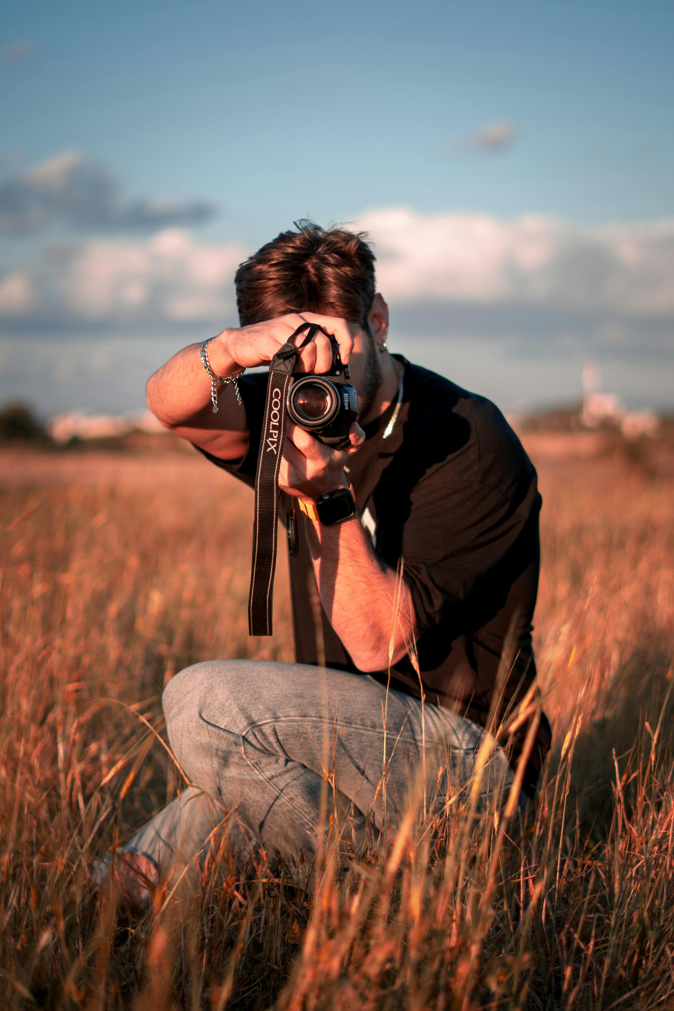 Woman Taking Pictures with Camera · Free Stock Photo