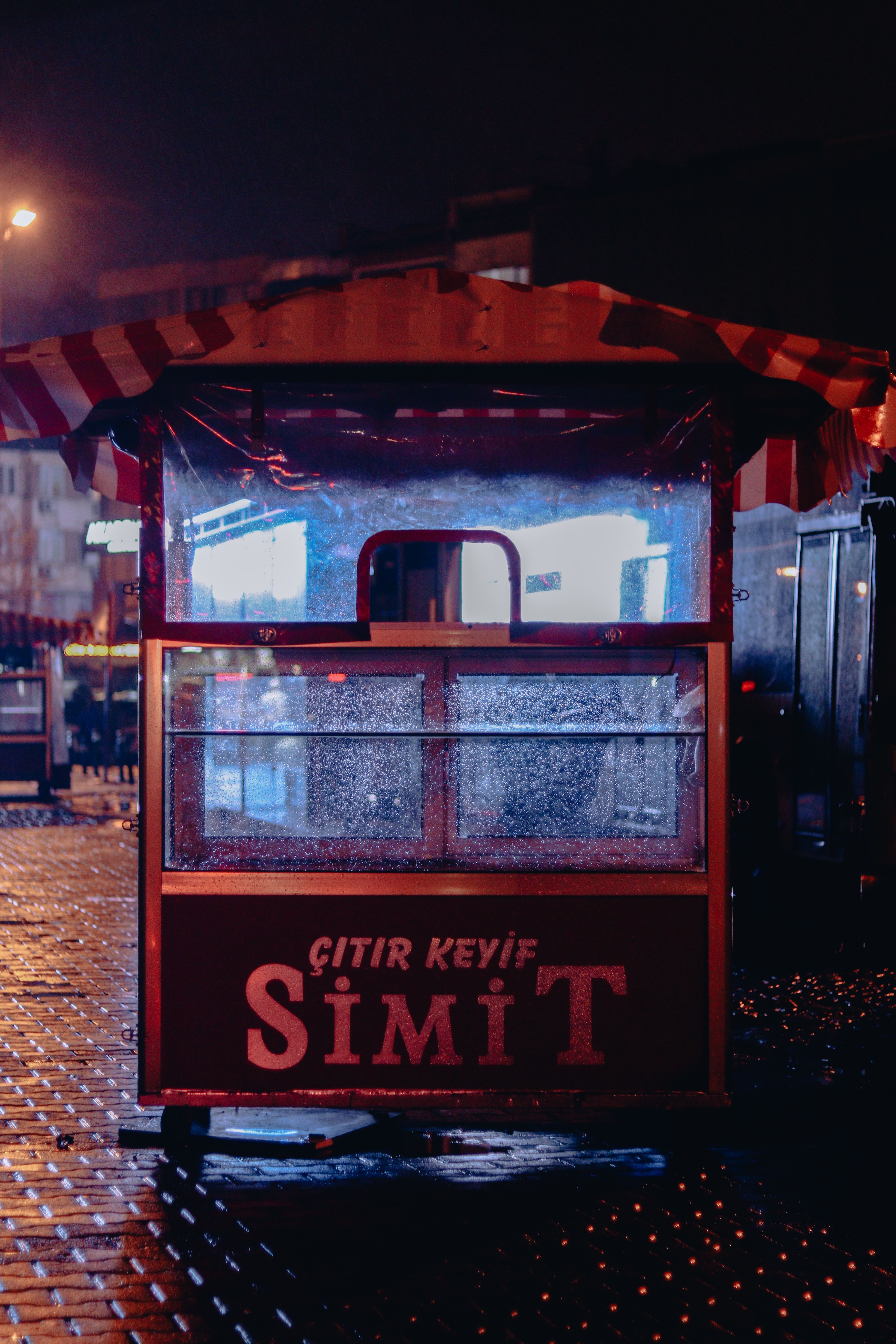 Street Food Stall next to Restaurant at Night · Free Stock Photo