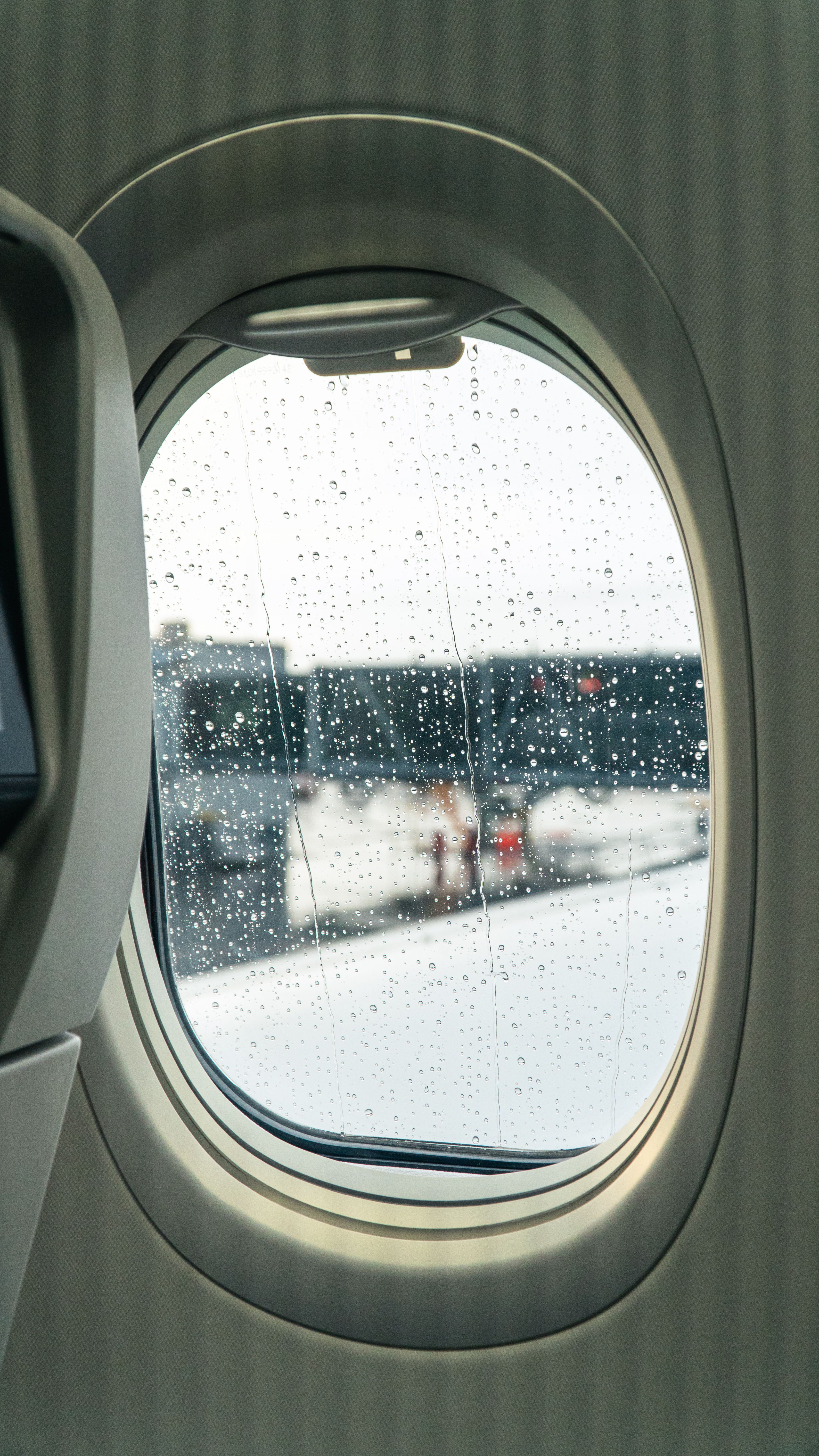 Raindrops on Airplane Window · Free Stock Photo