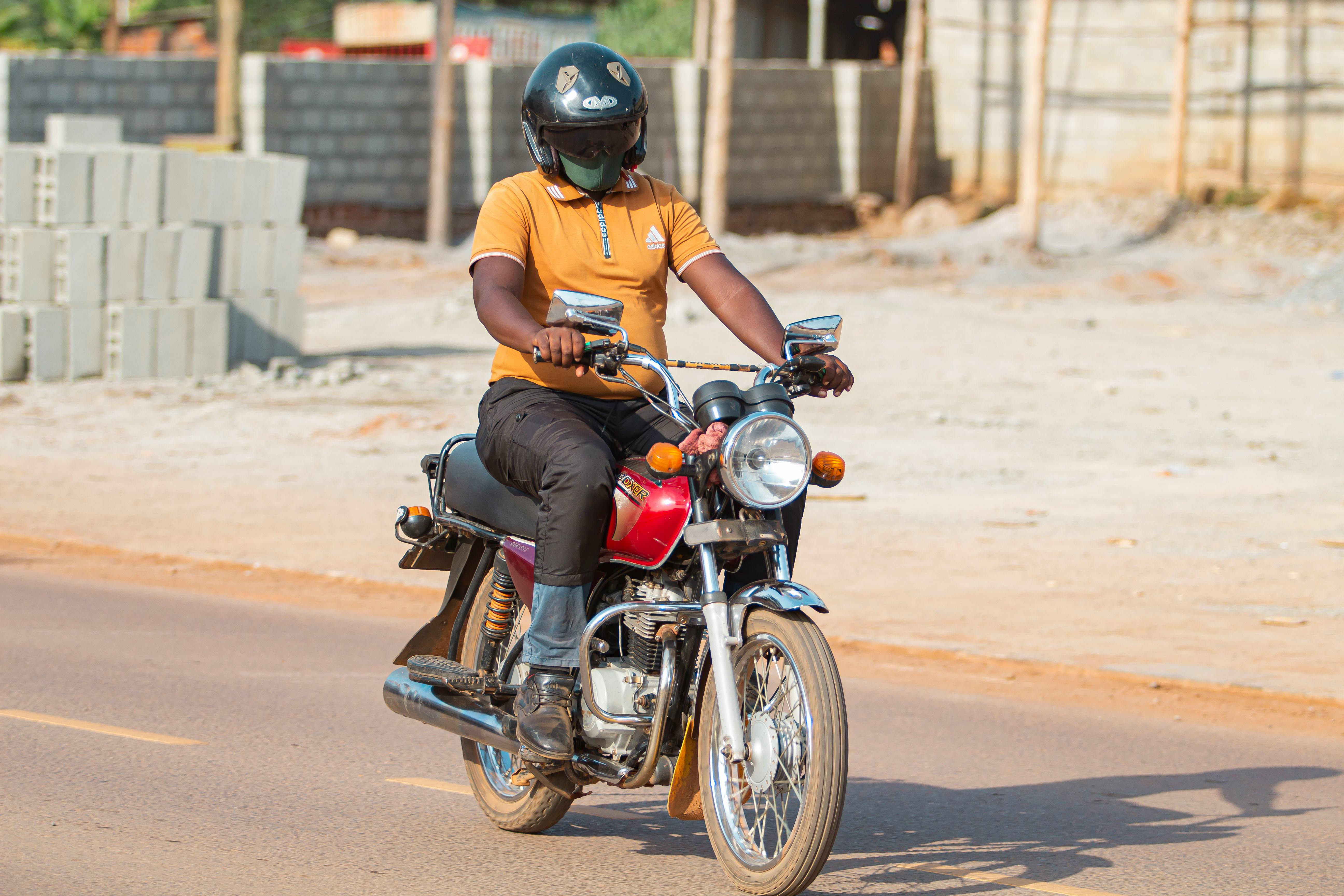 Person Riding Motorbike on Street · Free Stock Photo
