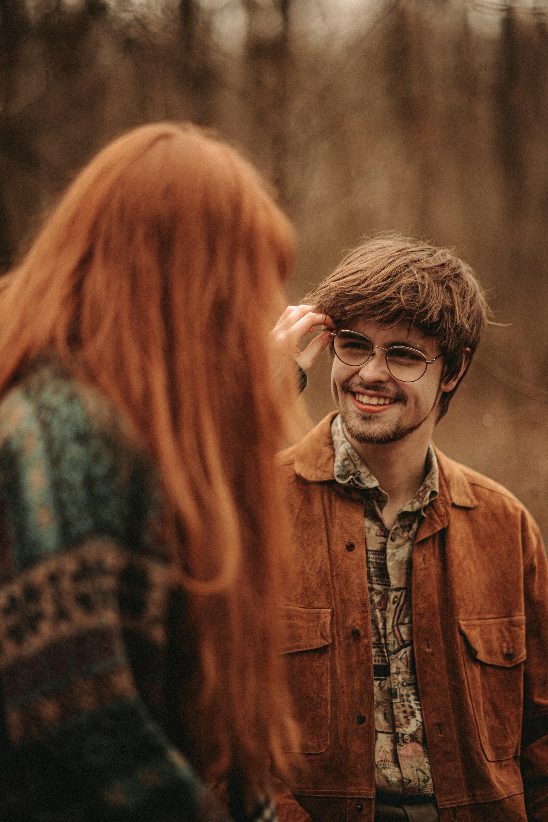 Smiling Woman in Varsity Jacket · Free Stock Photo