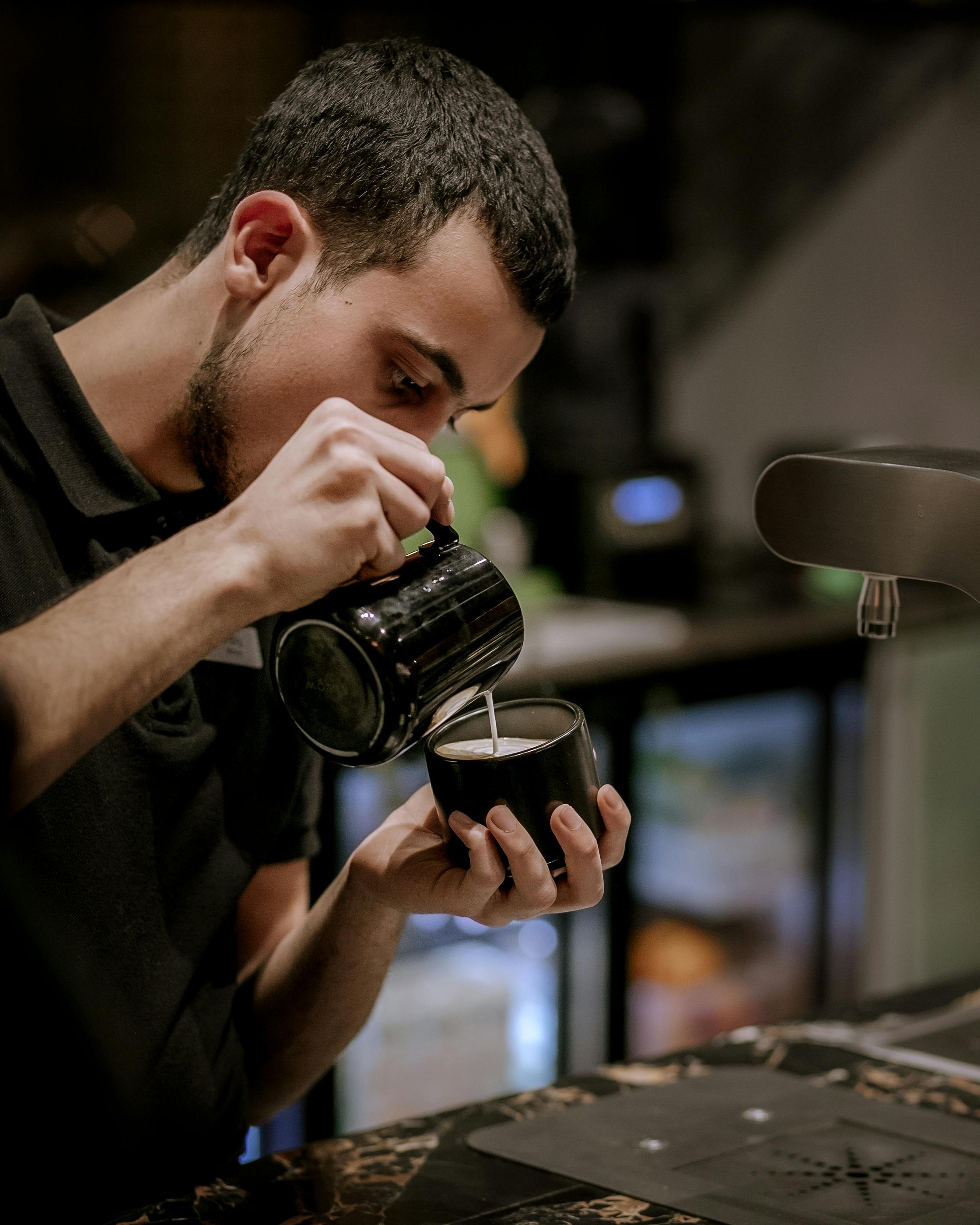 Barista Decorating Coffee with Milk · Free Stock Photo