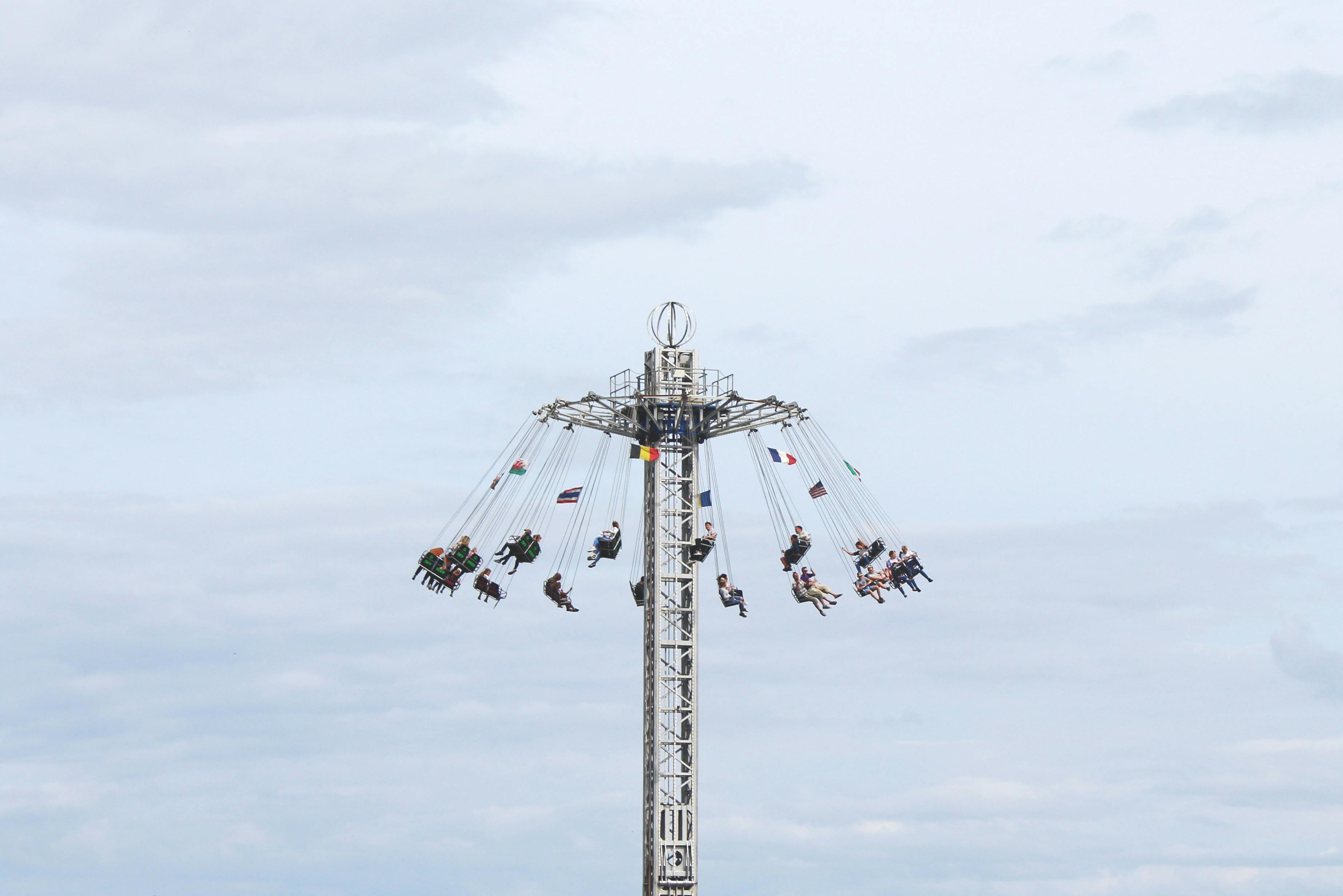 People Riding Tower Swing · Free Stock Photo