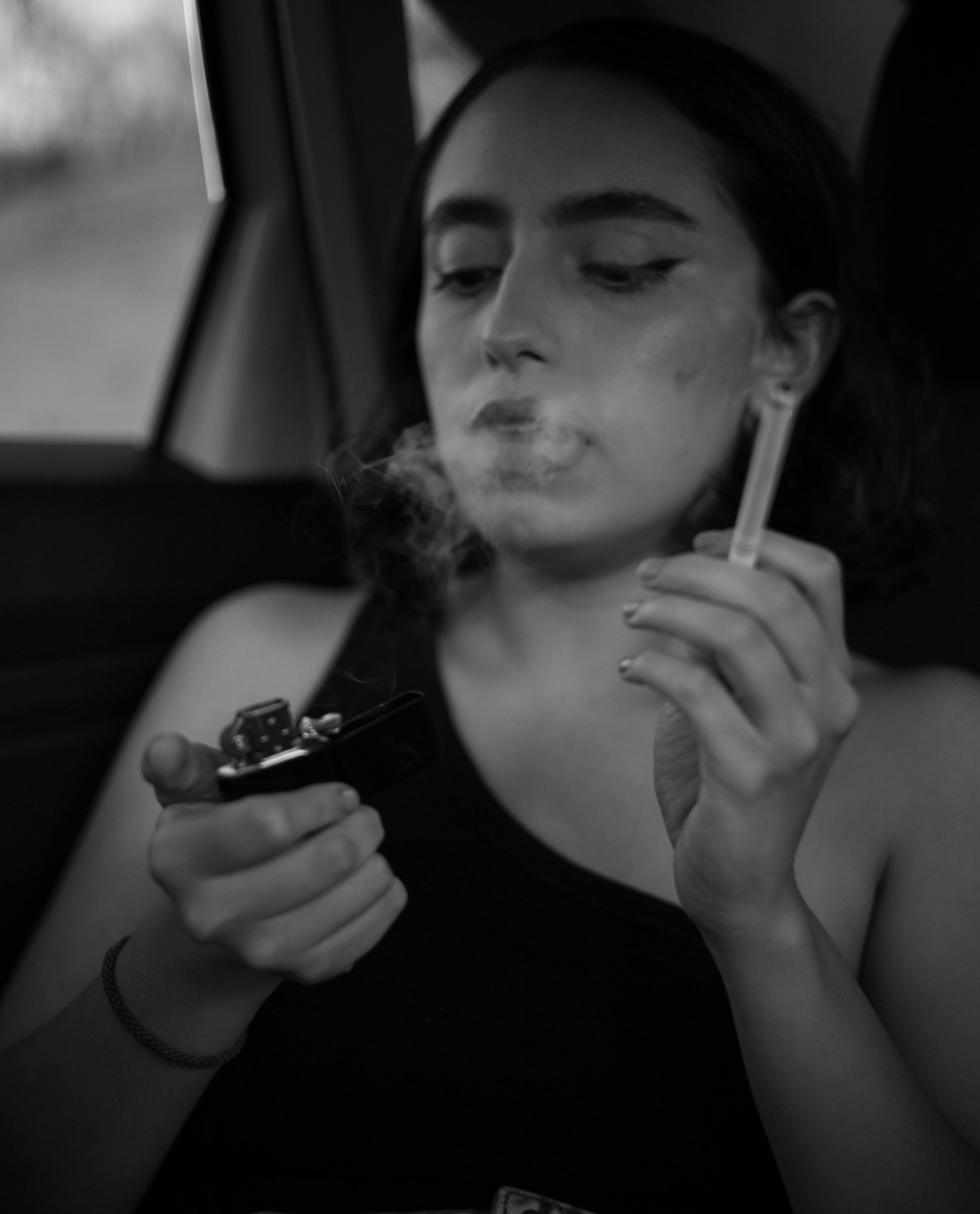 Woman Smoking Cigarette in Black and White · Free Stock Photo