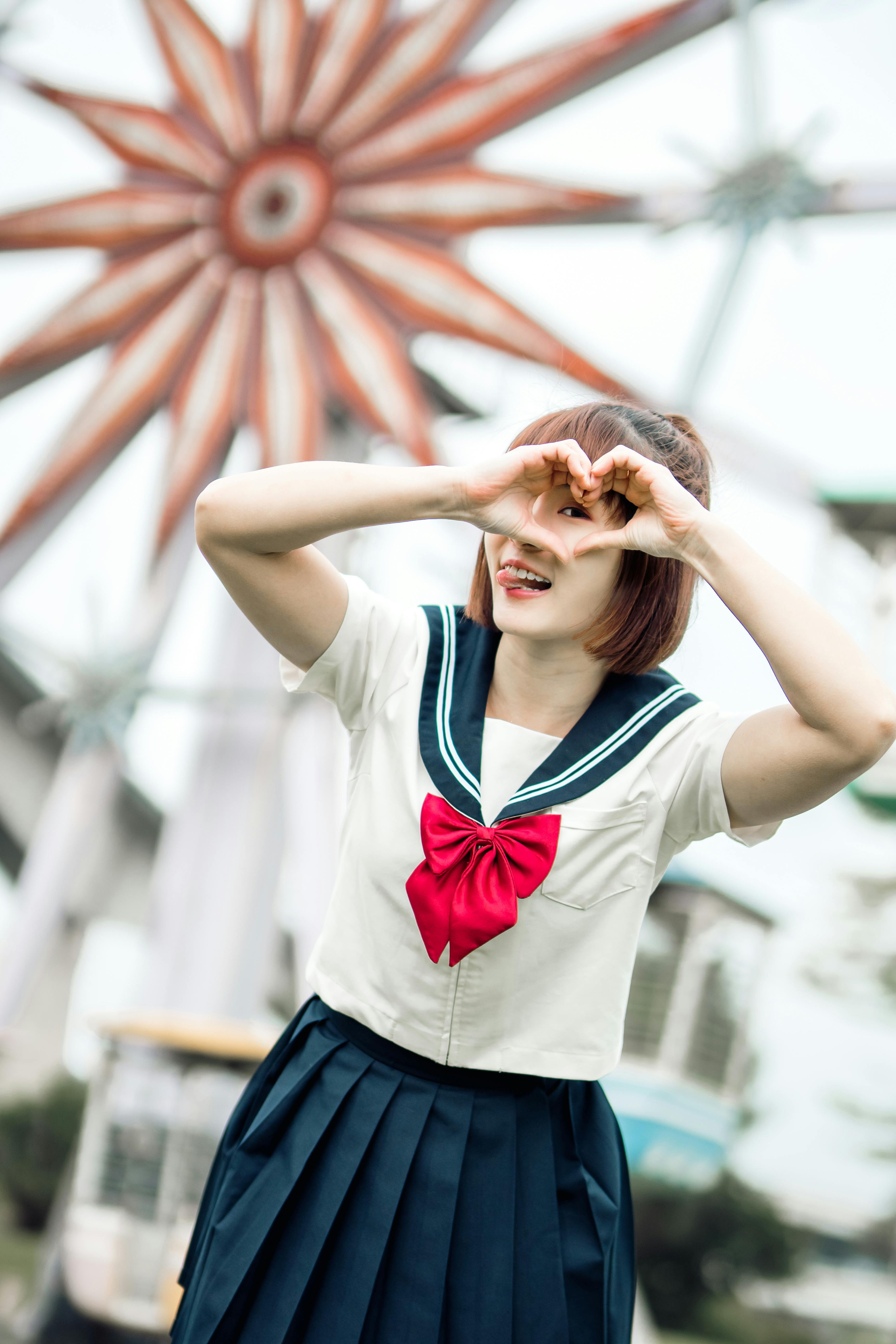 Woman Making Heart Gesture with Fingers of Both Hands · Free Stock Photo