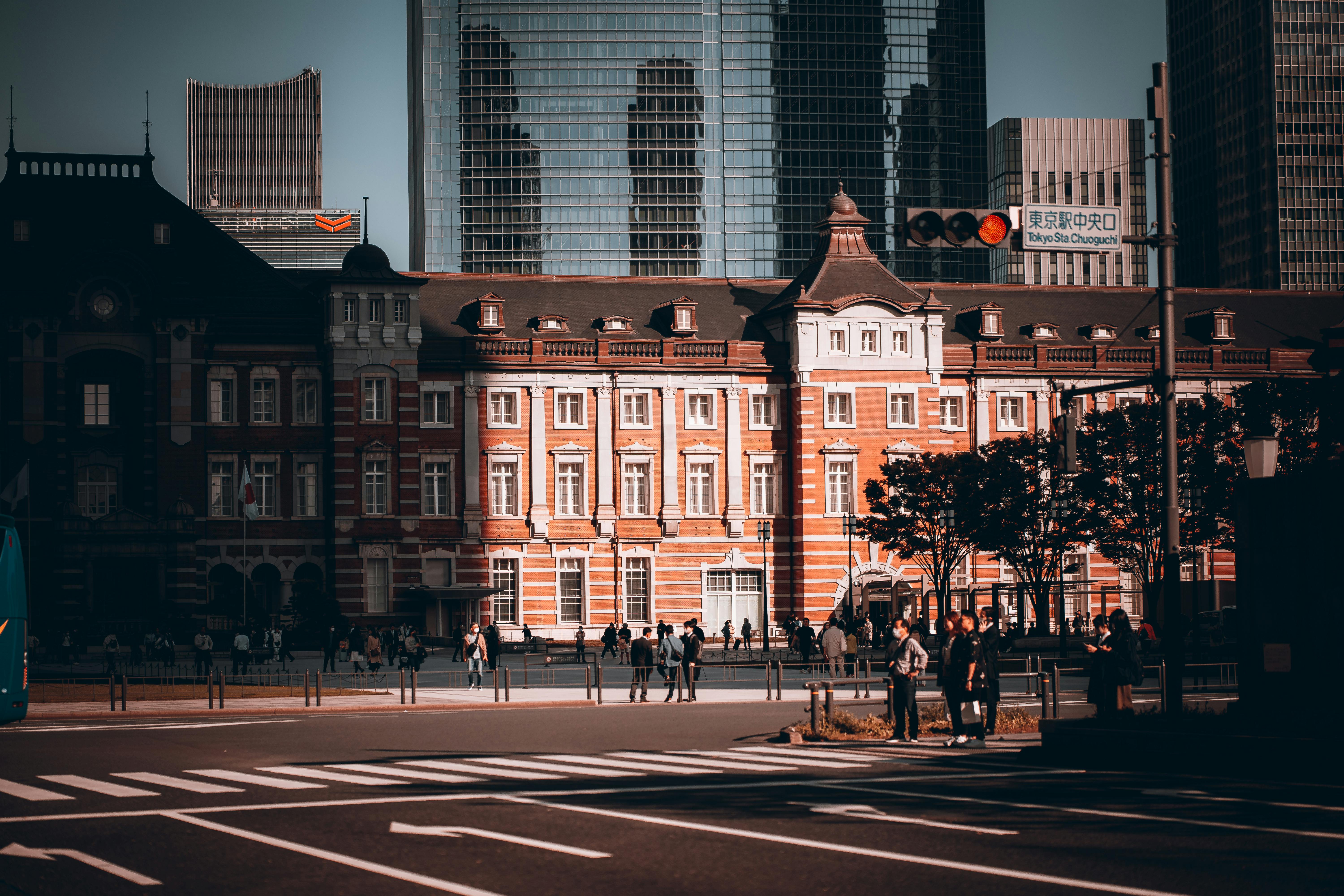 People Walking On The Streets Surrounded By Buildings · Free Stock Photo