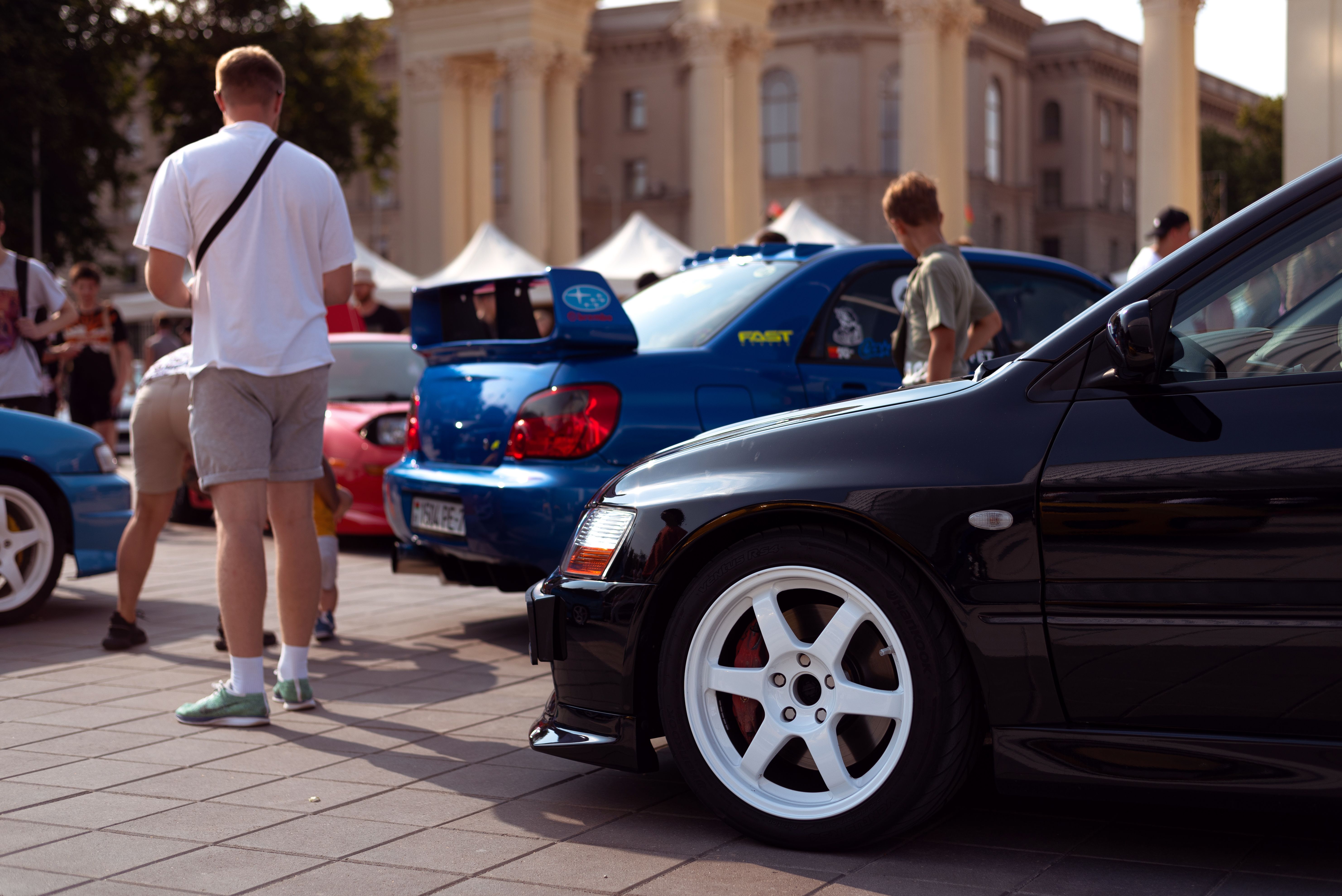 People Standing among Cars · Free Stock Photo