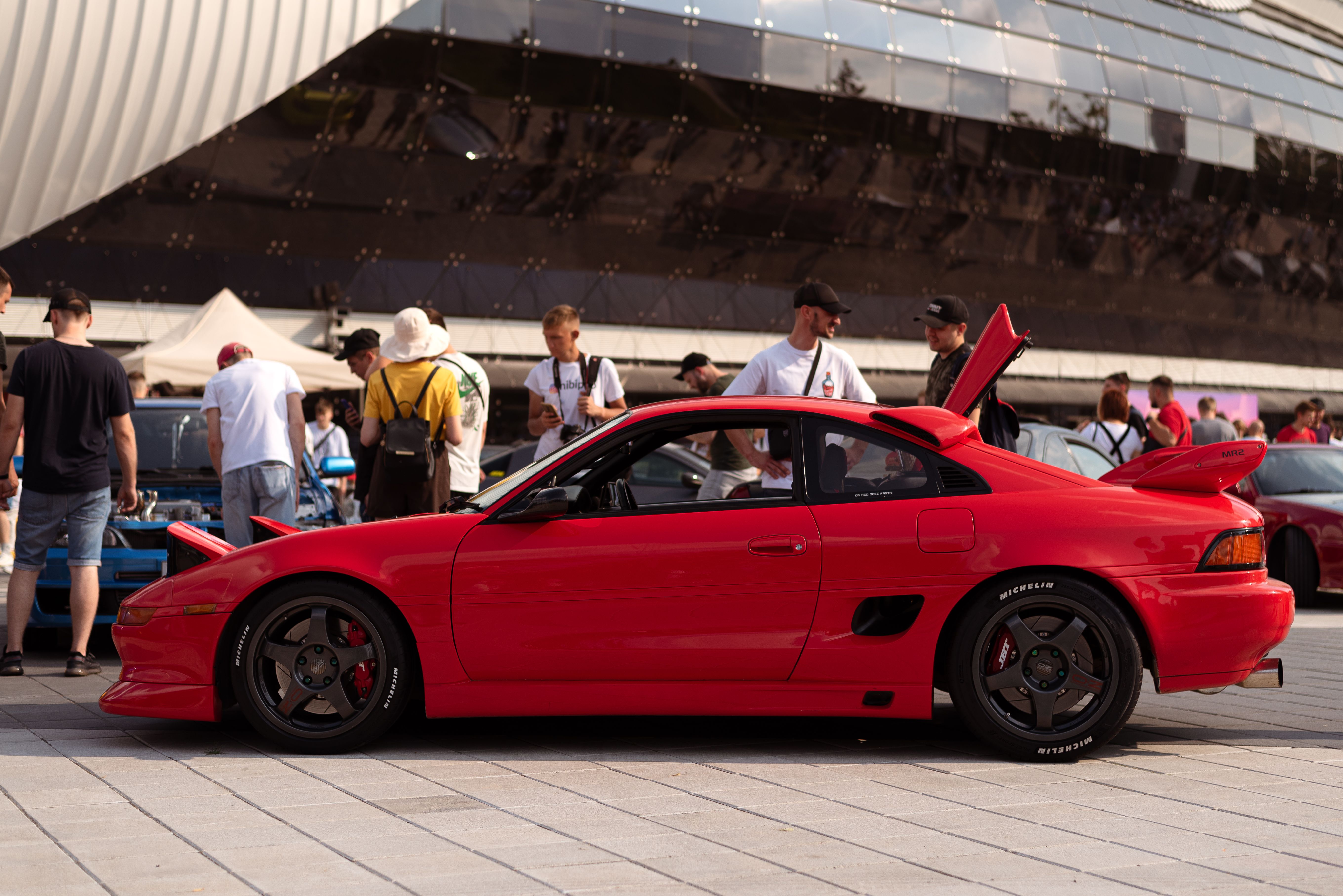 Red Toyota MR2 near Building · Free Stock Photo