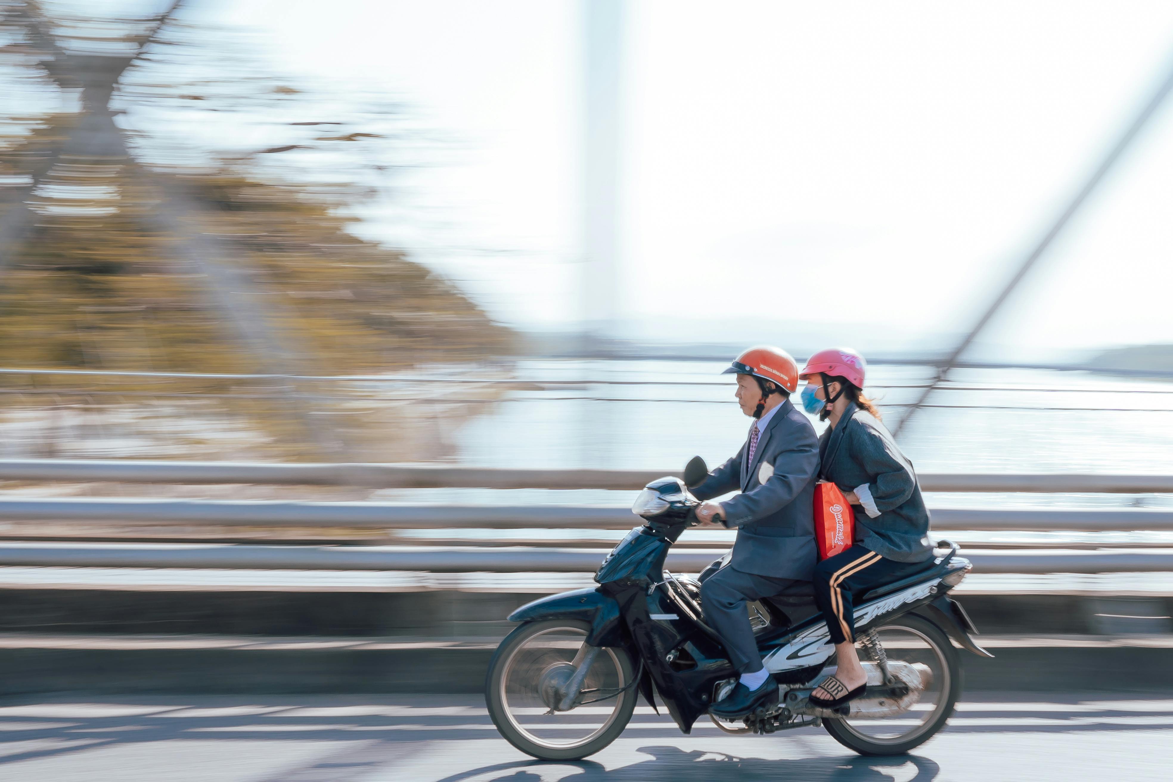 Man in Suit Riding Motorcycle with Woman · Free Stock Photo