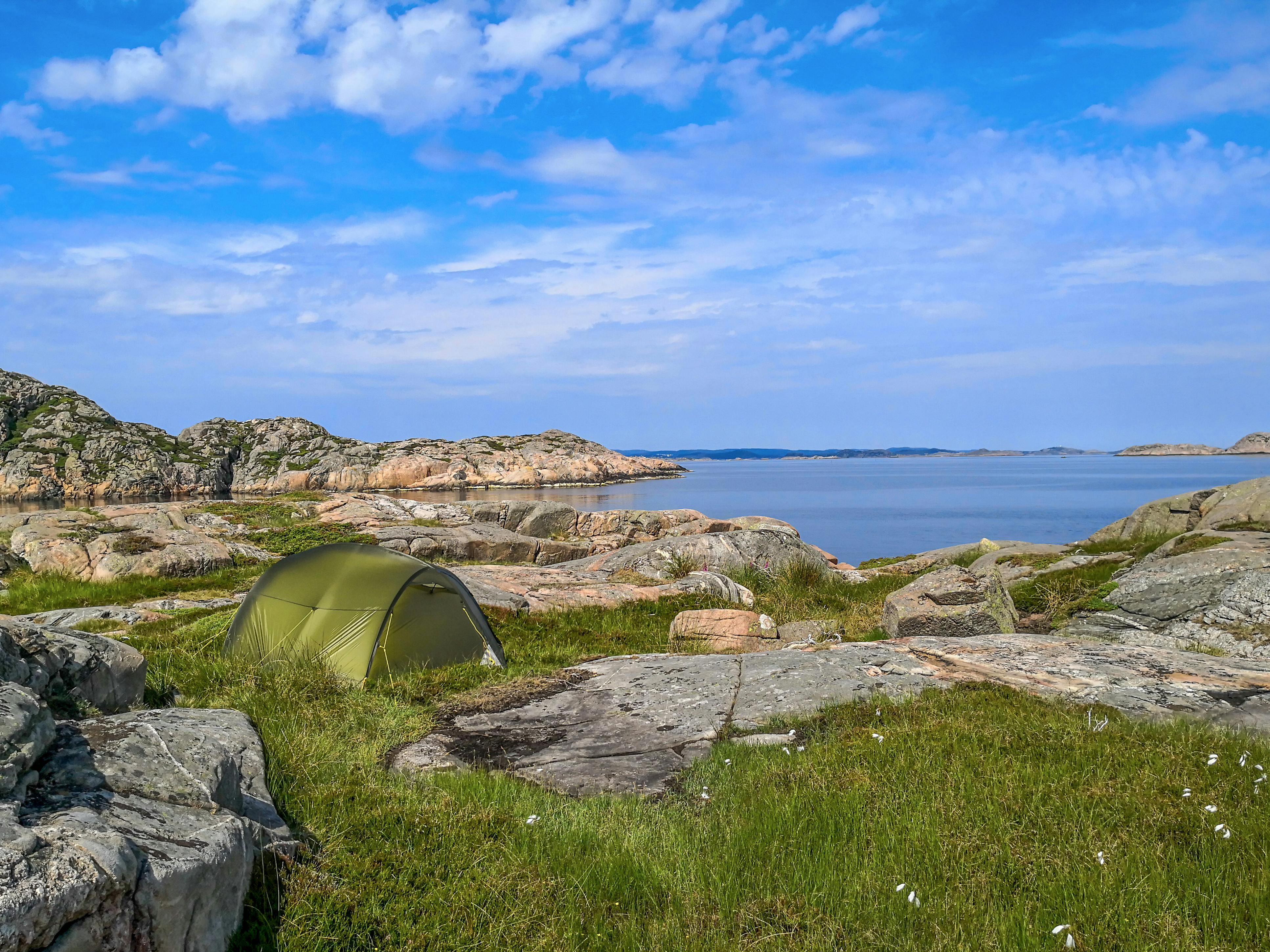 Tent among Rocks on Sea Coast · Free Stock Photo
