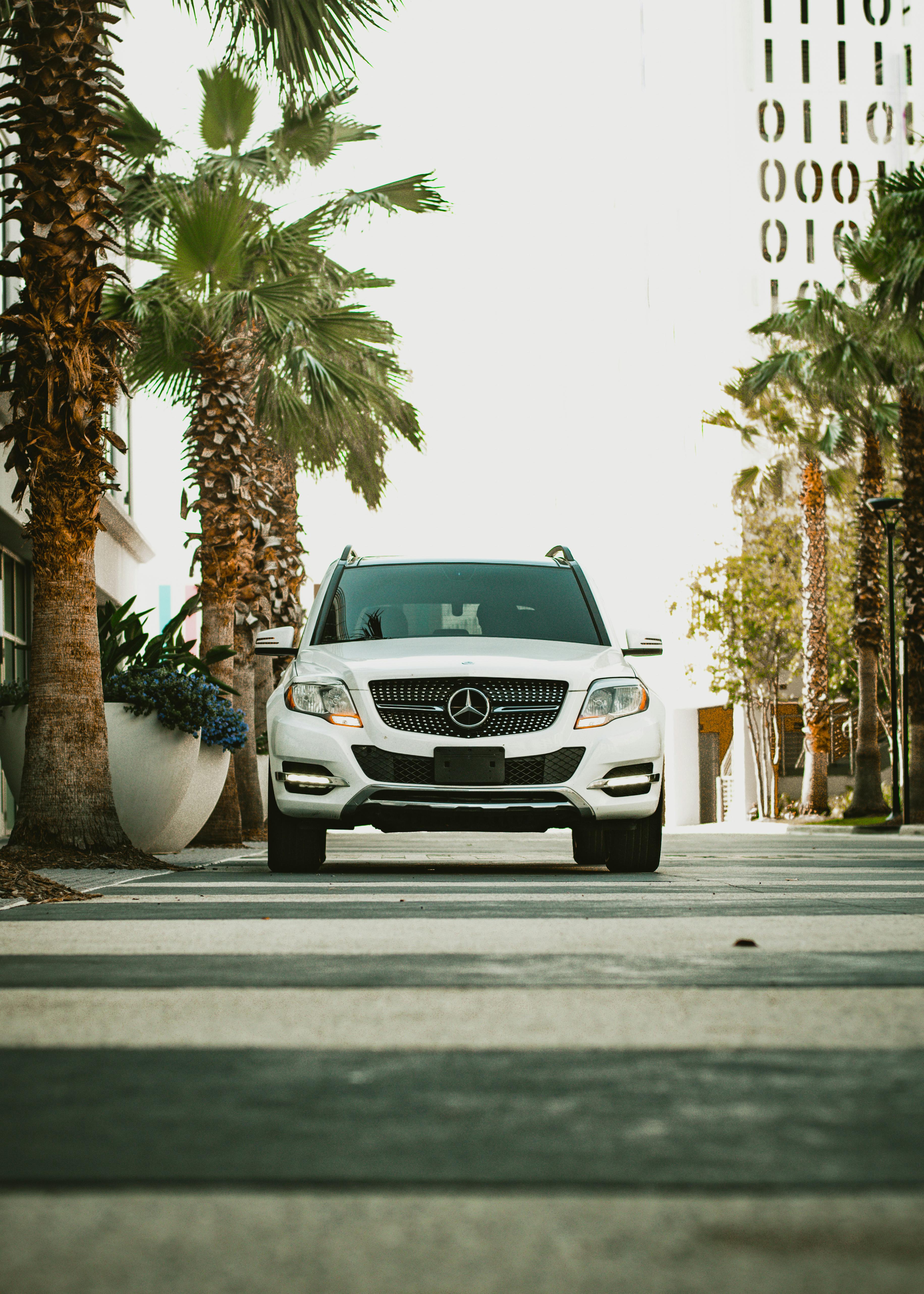 A White Modern Mercedes-Benz on the Street in City · Free Stock Photo