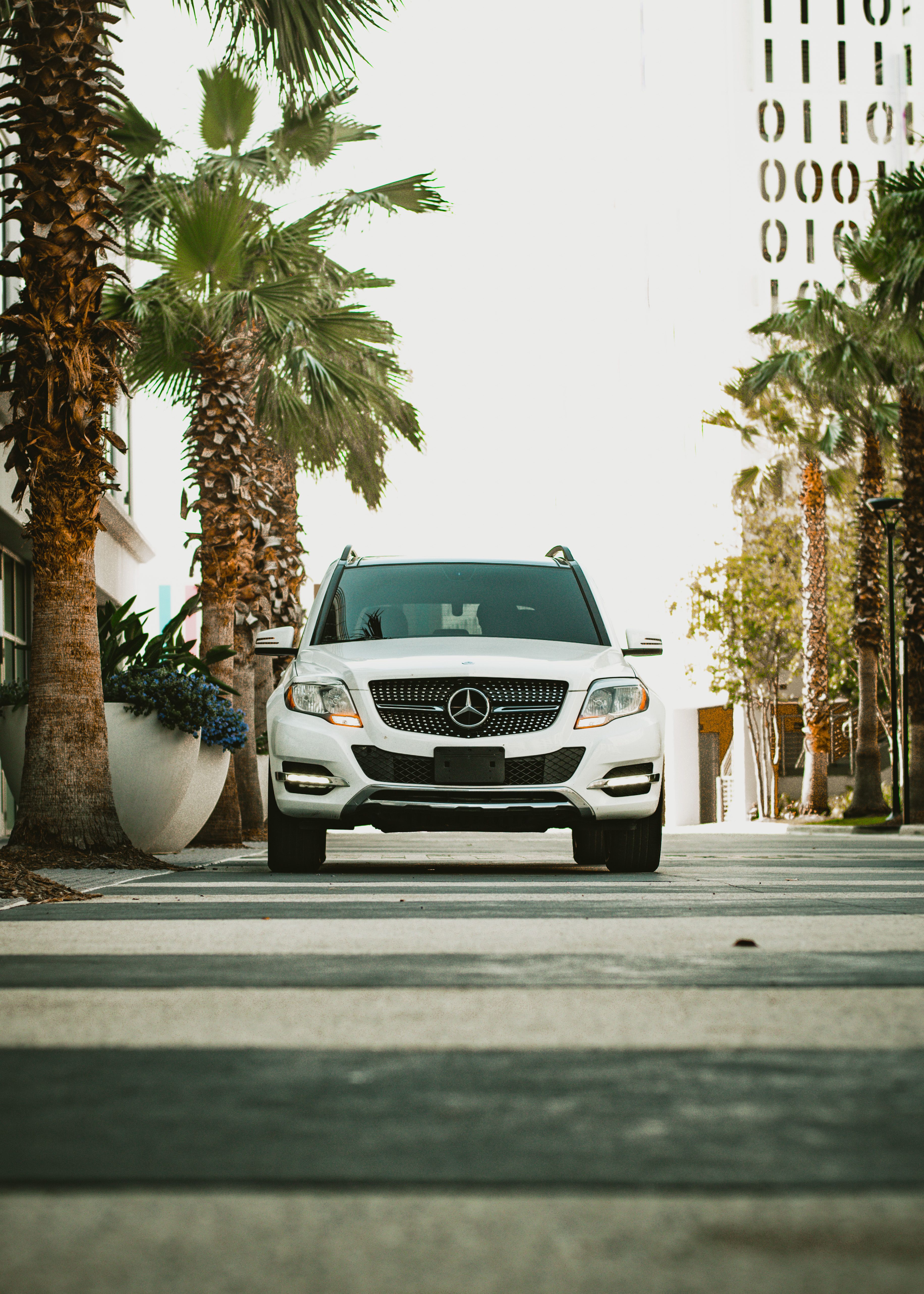 A White Modern Mercedes-Benz on the Street in City · Free Stock Photo