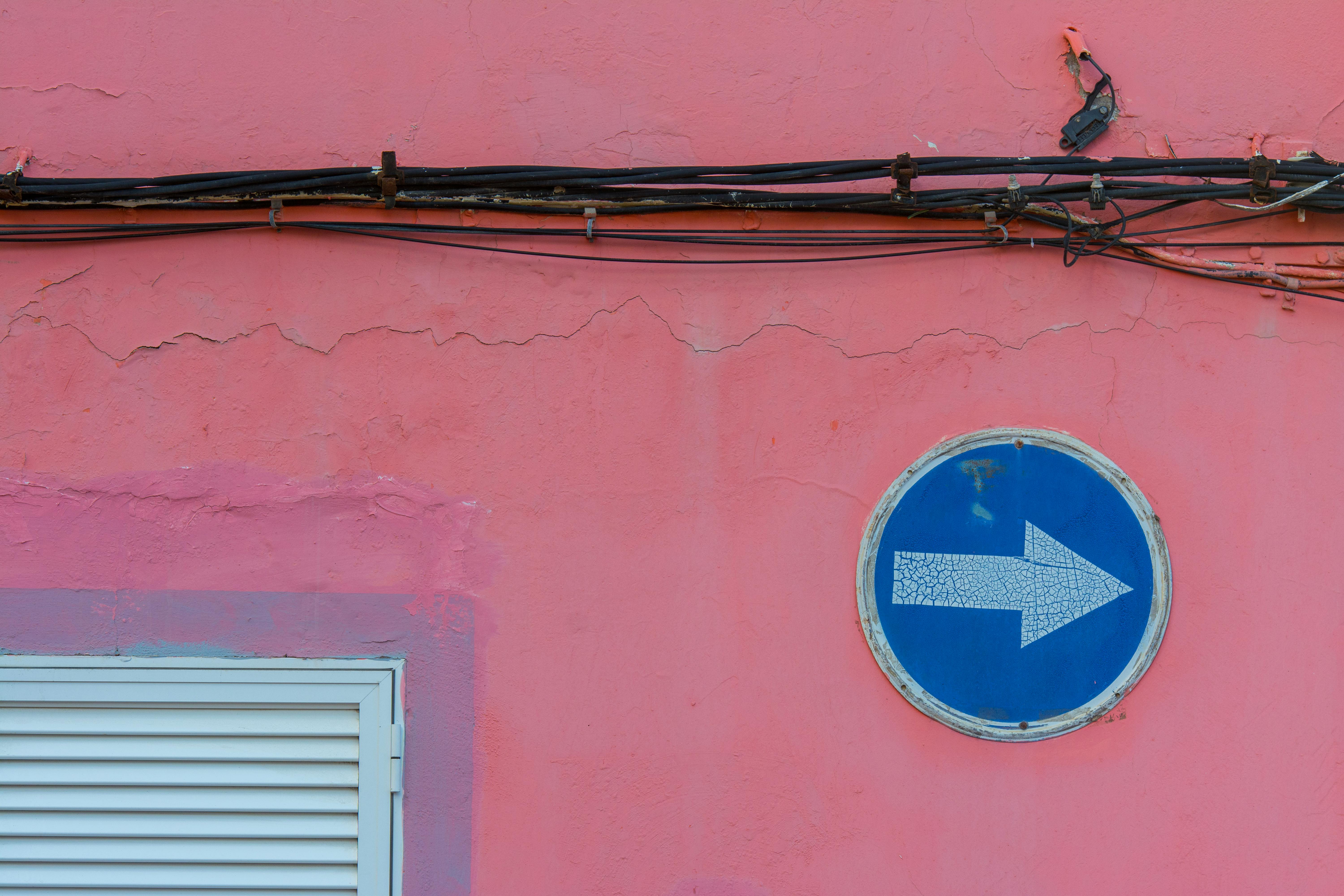 Road Sign and Wires on Building Wall · Free Stock Photo