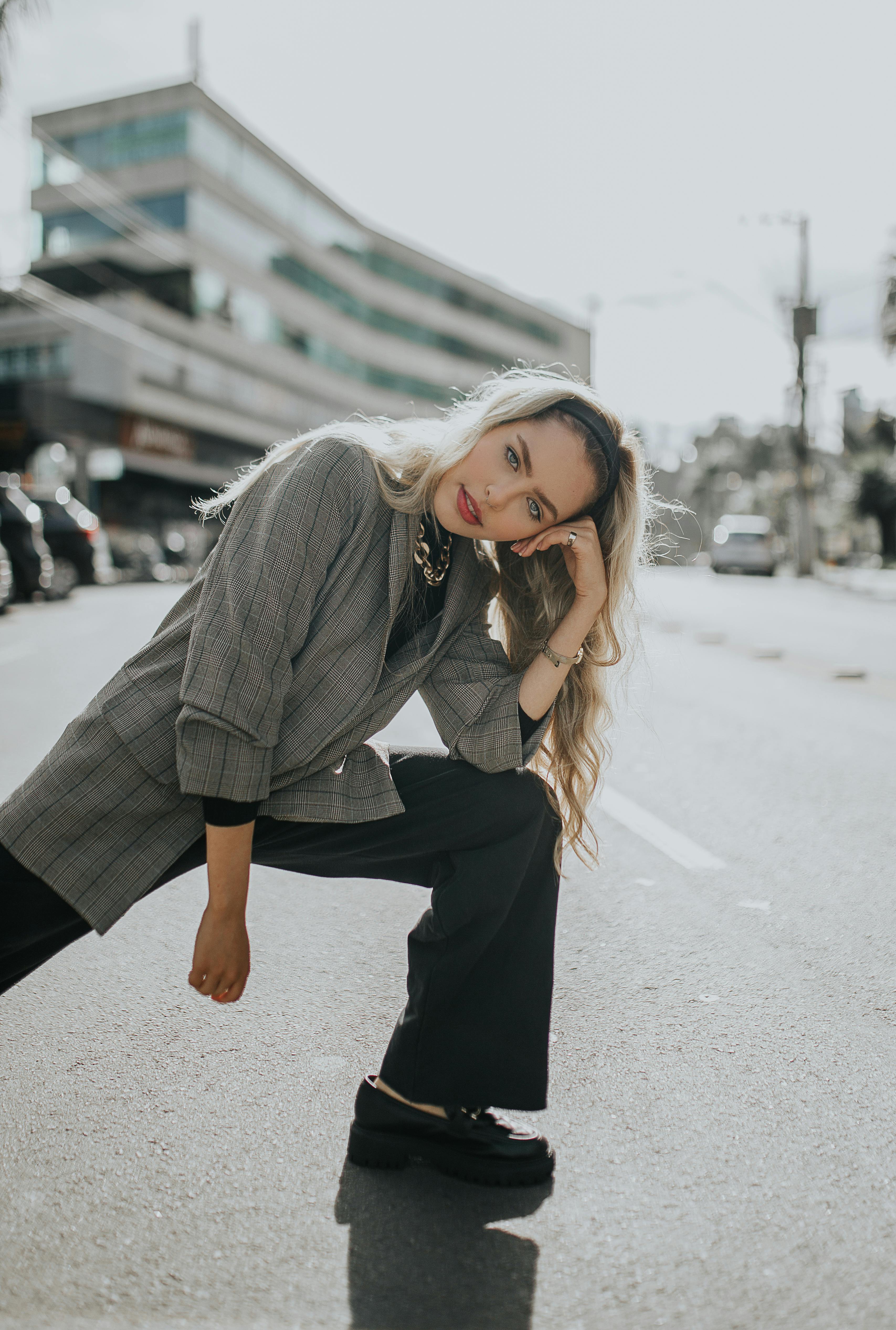 Woman Crouching and Posing on Street · Free Stock Photo