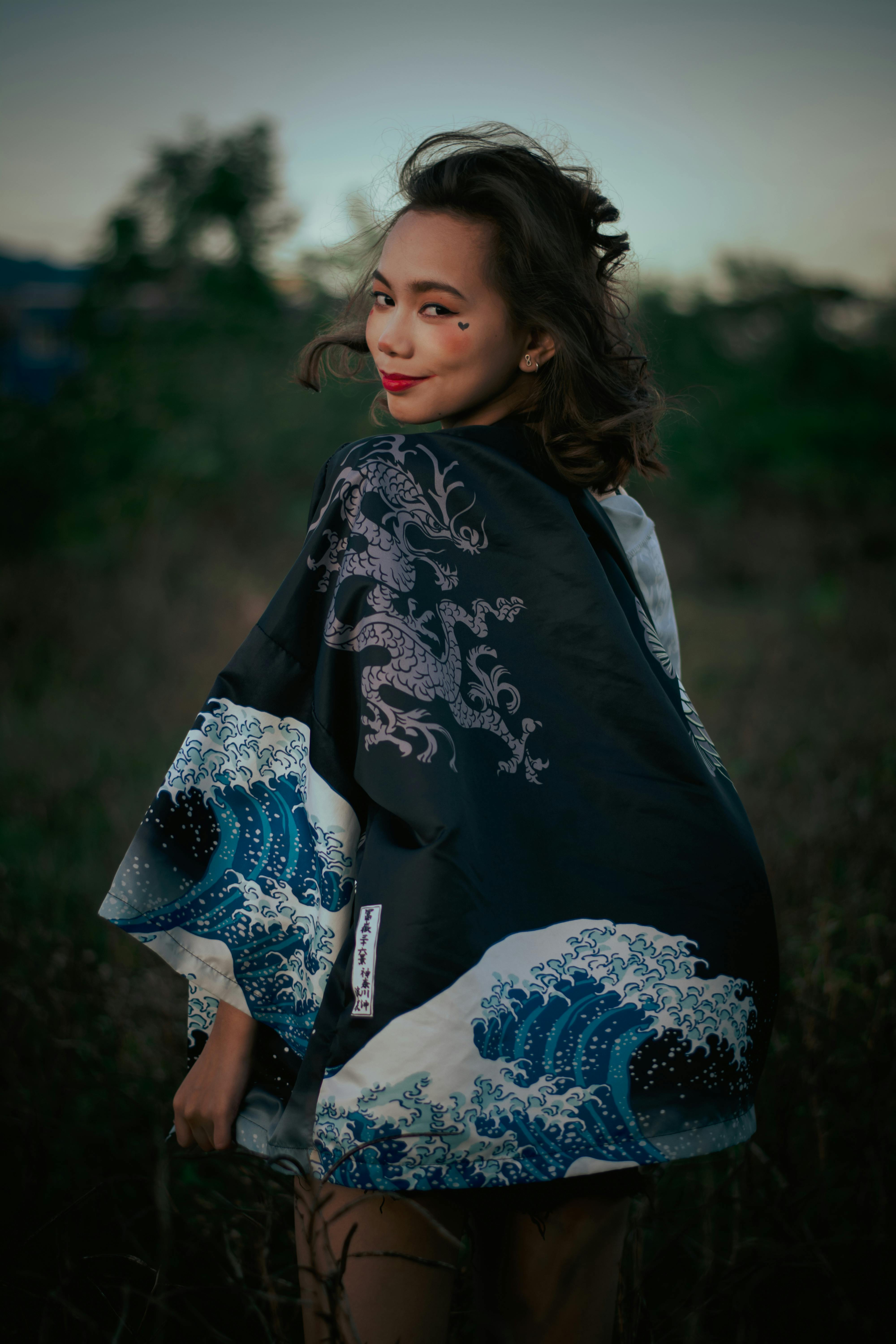 Young Woman Wearing a Gown with a Wave Pattern · Free Stock Photo