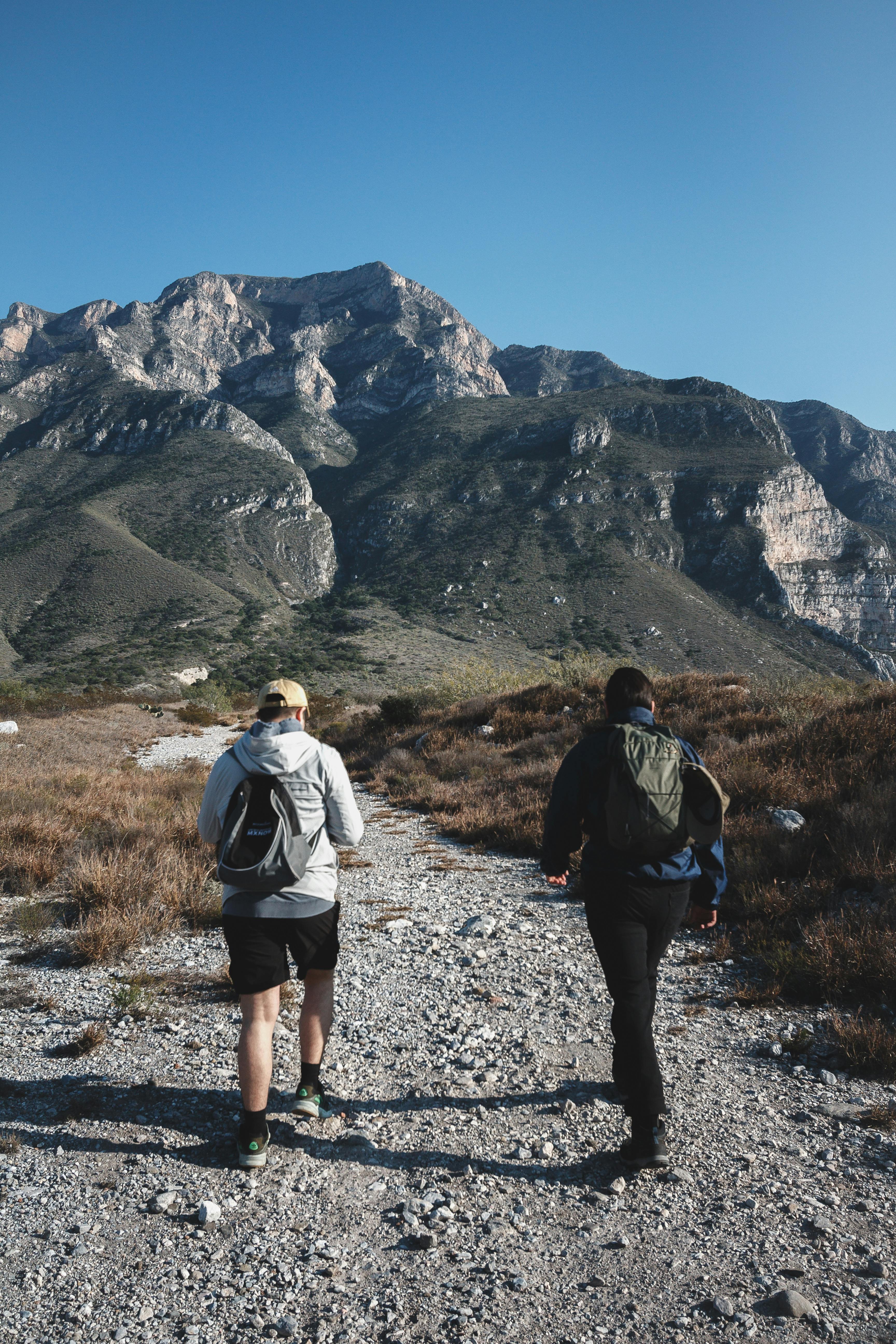 Backpackers Hiking in the Mountains · Free Stock Photo