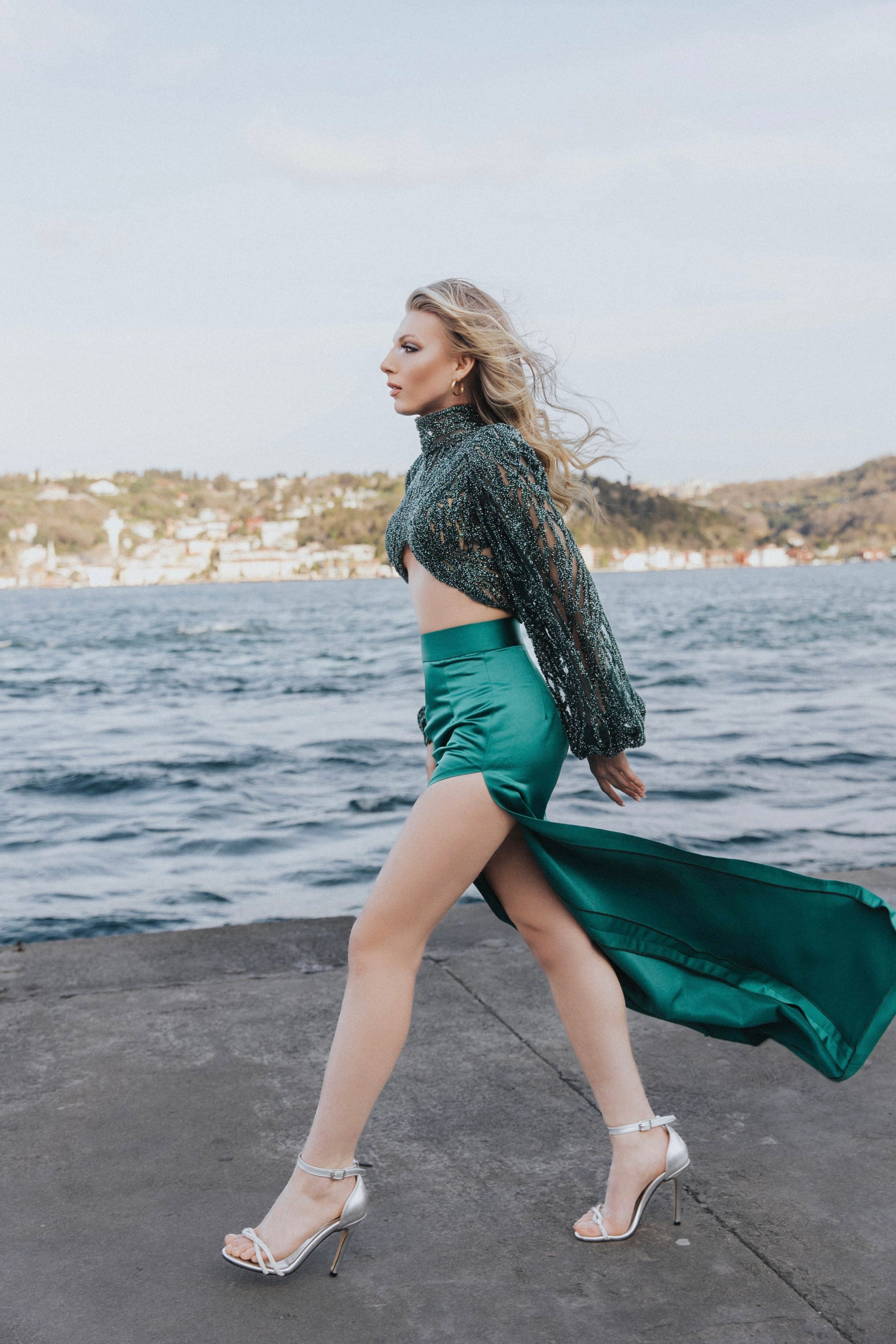 Young Woman in a Glamour Outfit Walking on the Seashore · Free Stock Photo