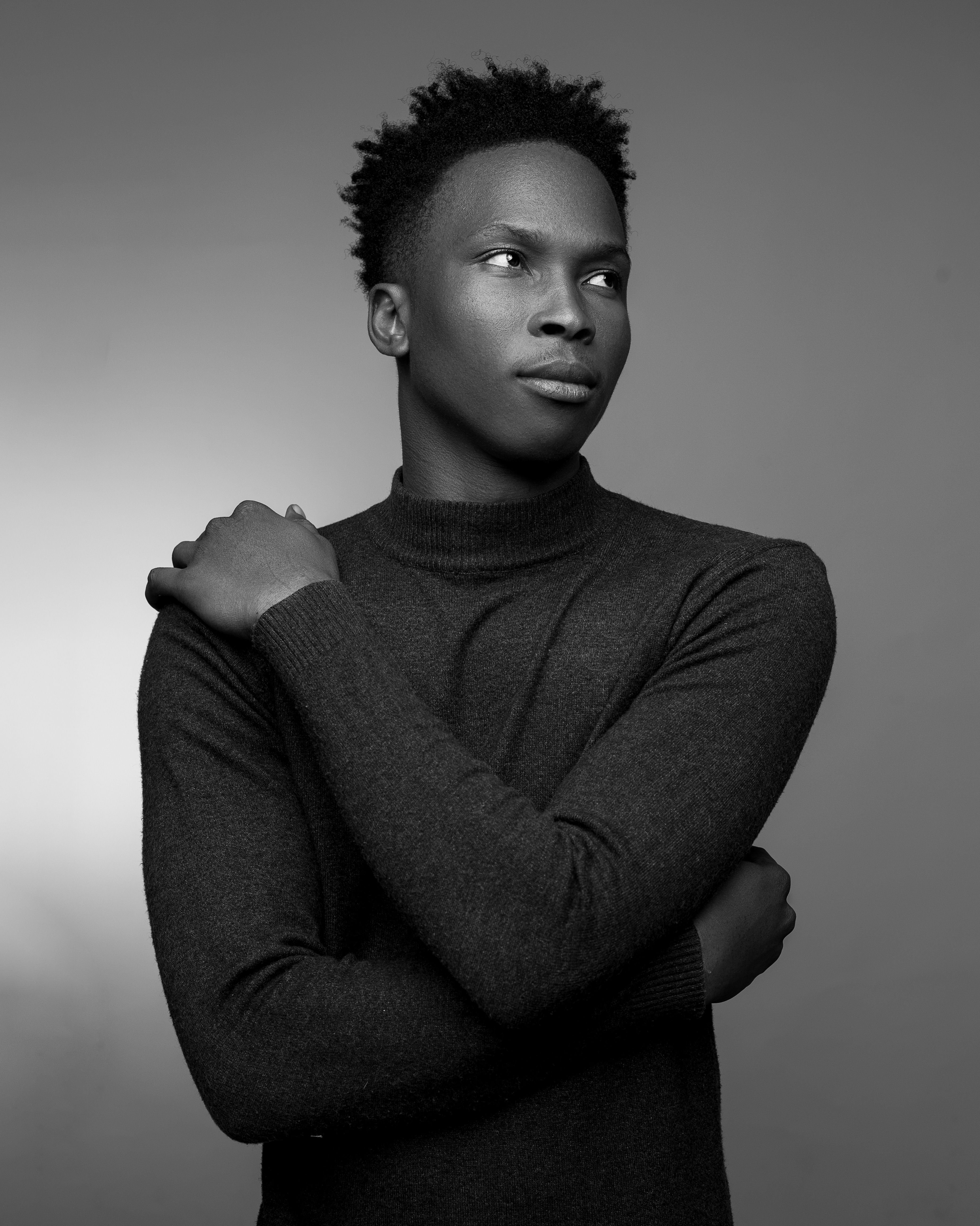 Young Man Posing on Grey Background · Free Stock Photo