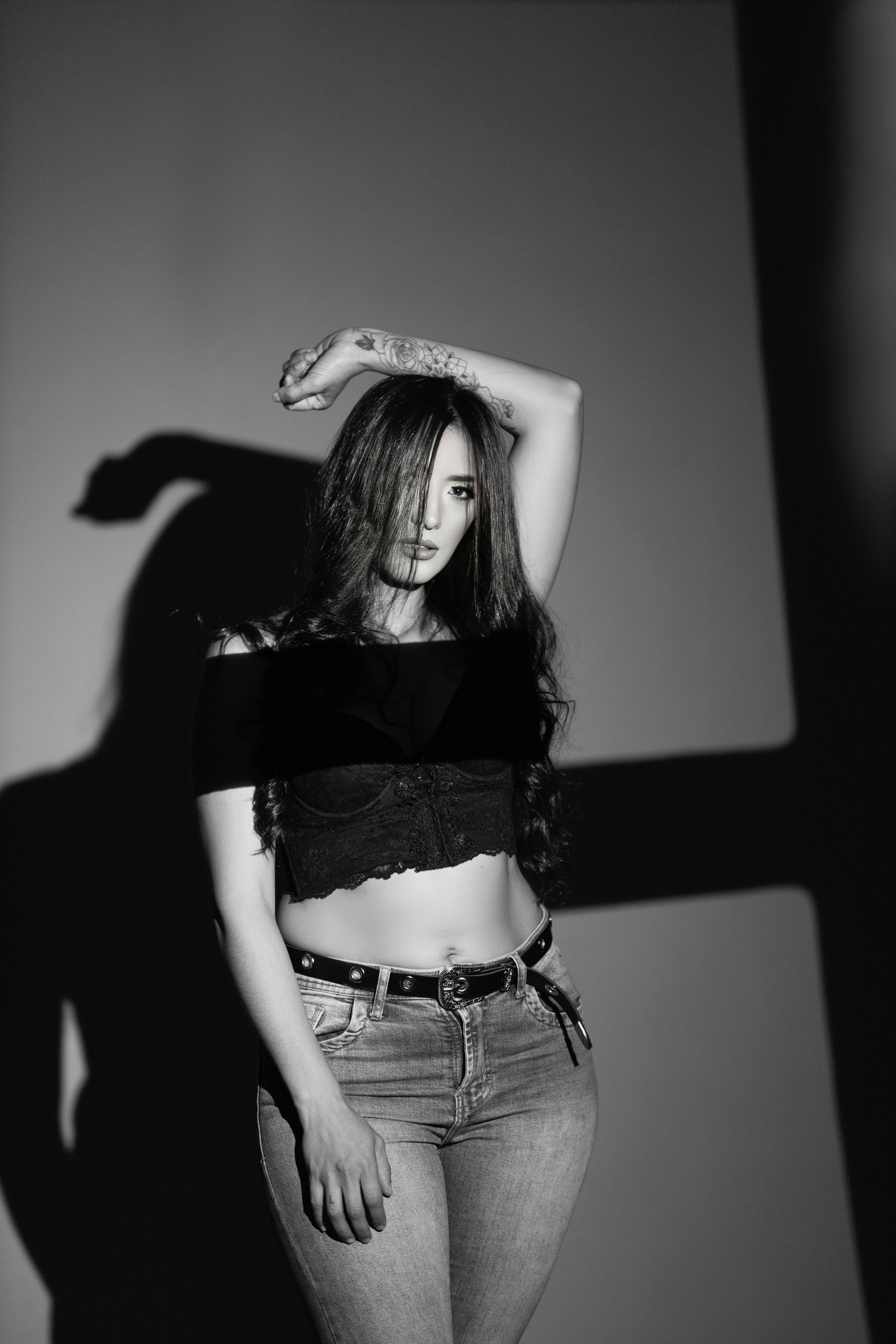 Beautiful Young Woman with Her Left Arm over Her Head · Free Stock Photo