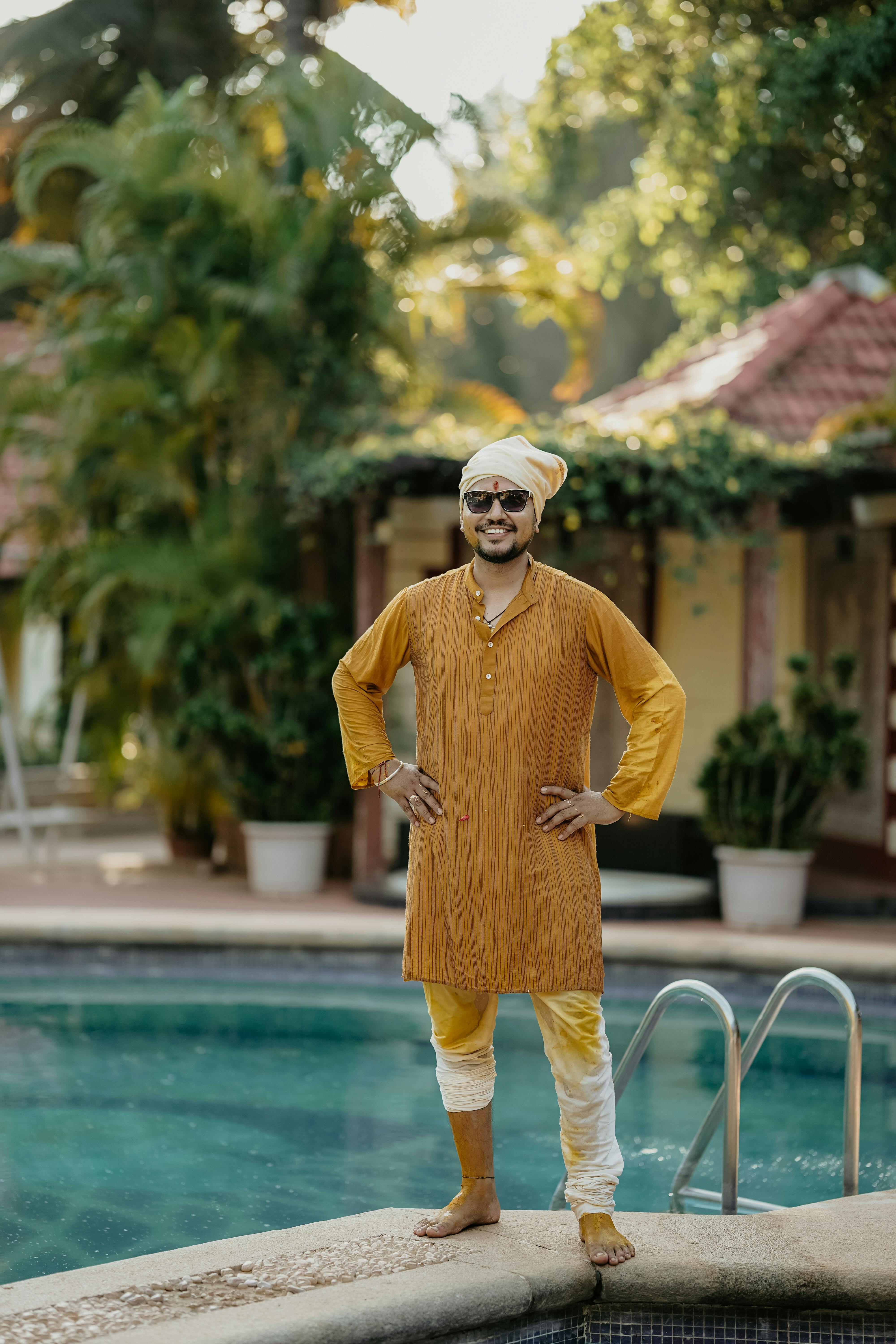 A Smiling Man in Traditional Indian Clothing over the Pool · Free Stock ...