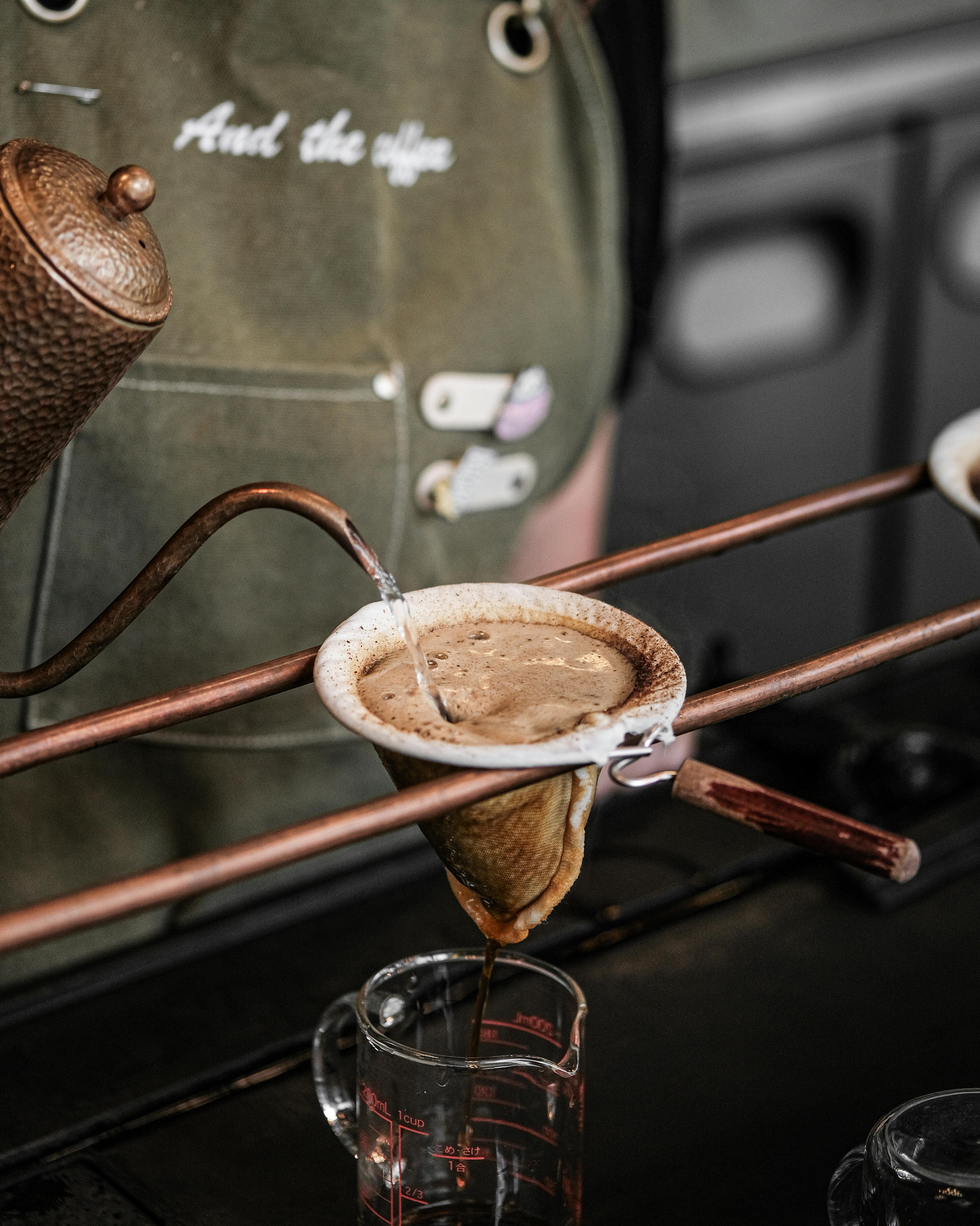 Barista Brewing Coffee in Cafe · Free Stock Photo