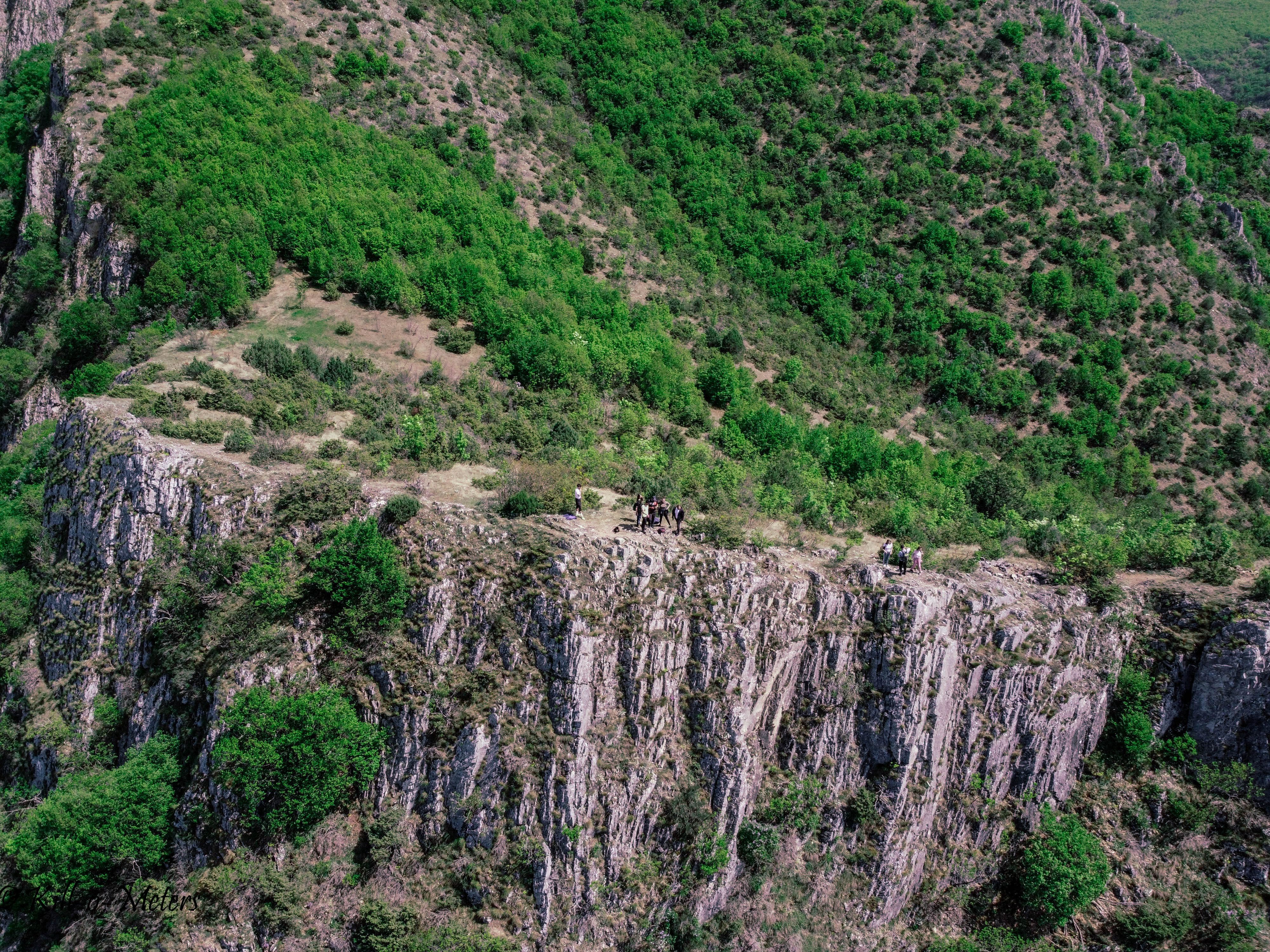 Hikers on a Tall Cliff · Free Stock Photo