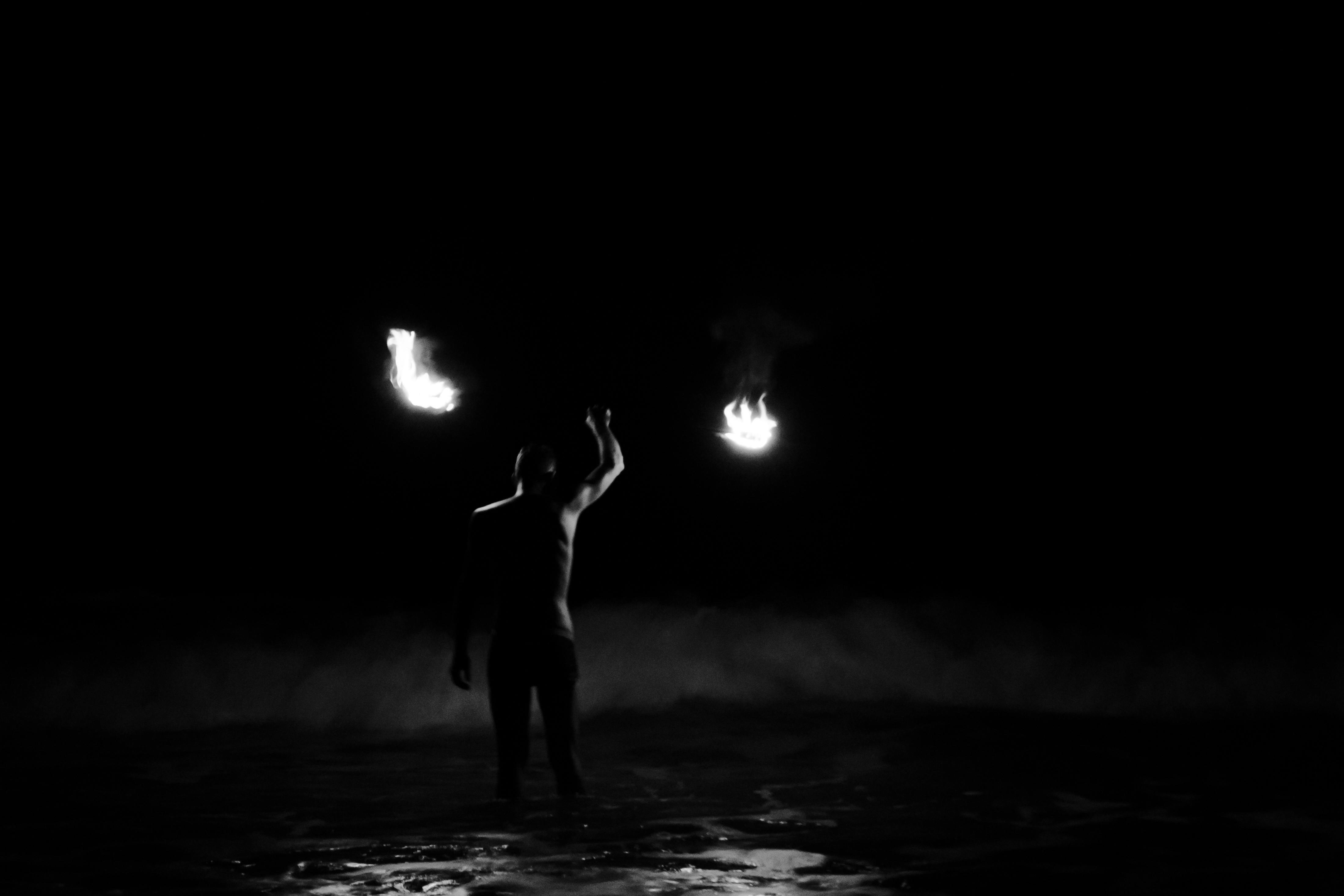 Back View of Man with Torch at Night · Free Stock Photo