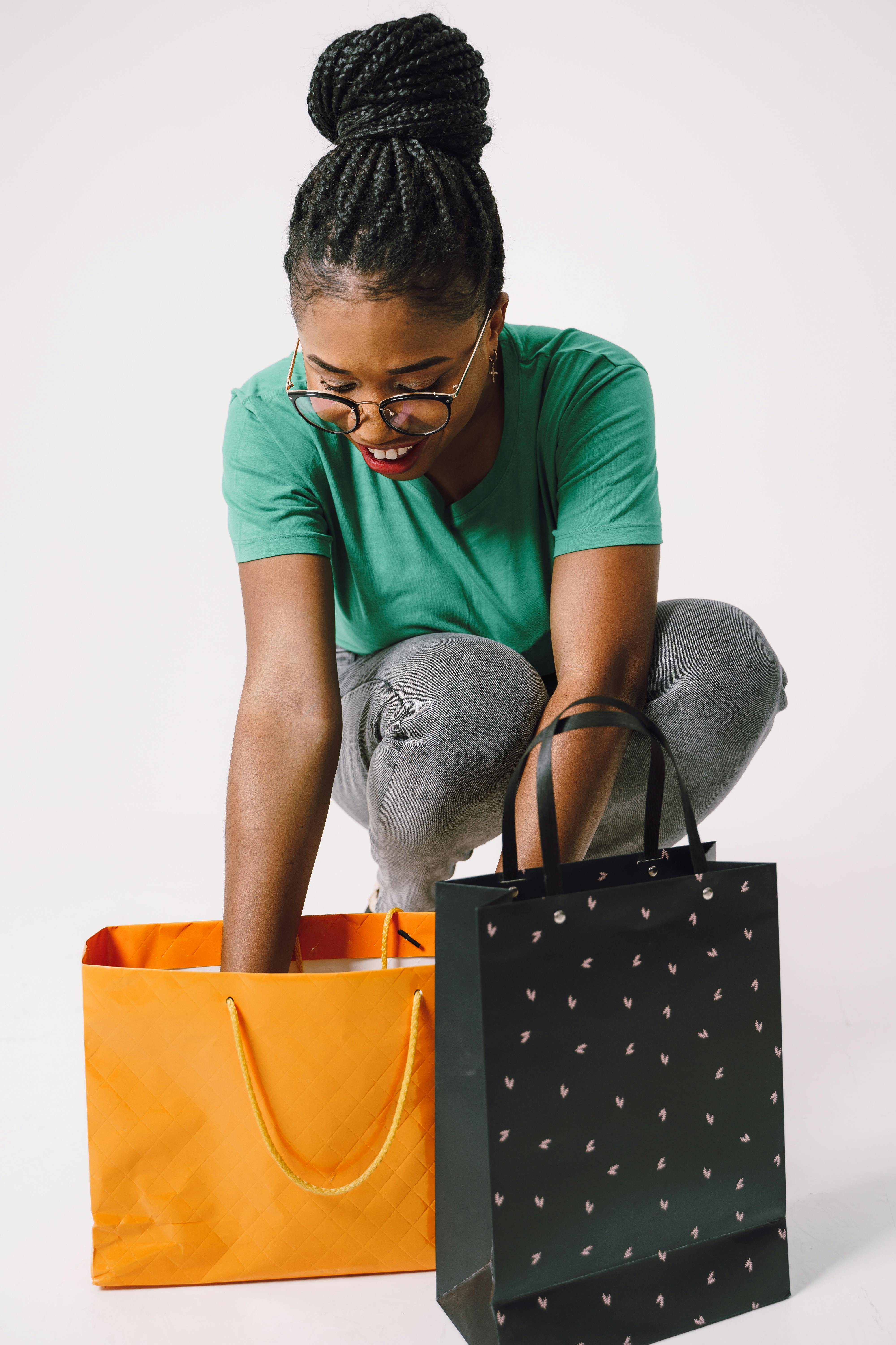 Woman Unpacking Shopping Bags · Free Stock Photo