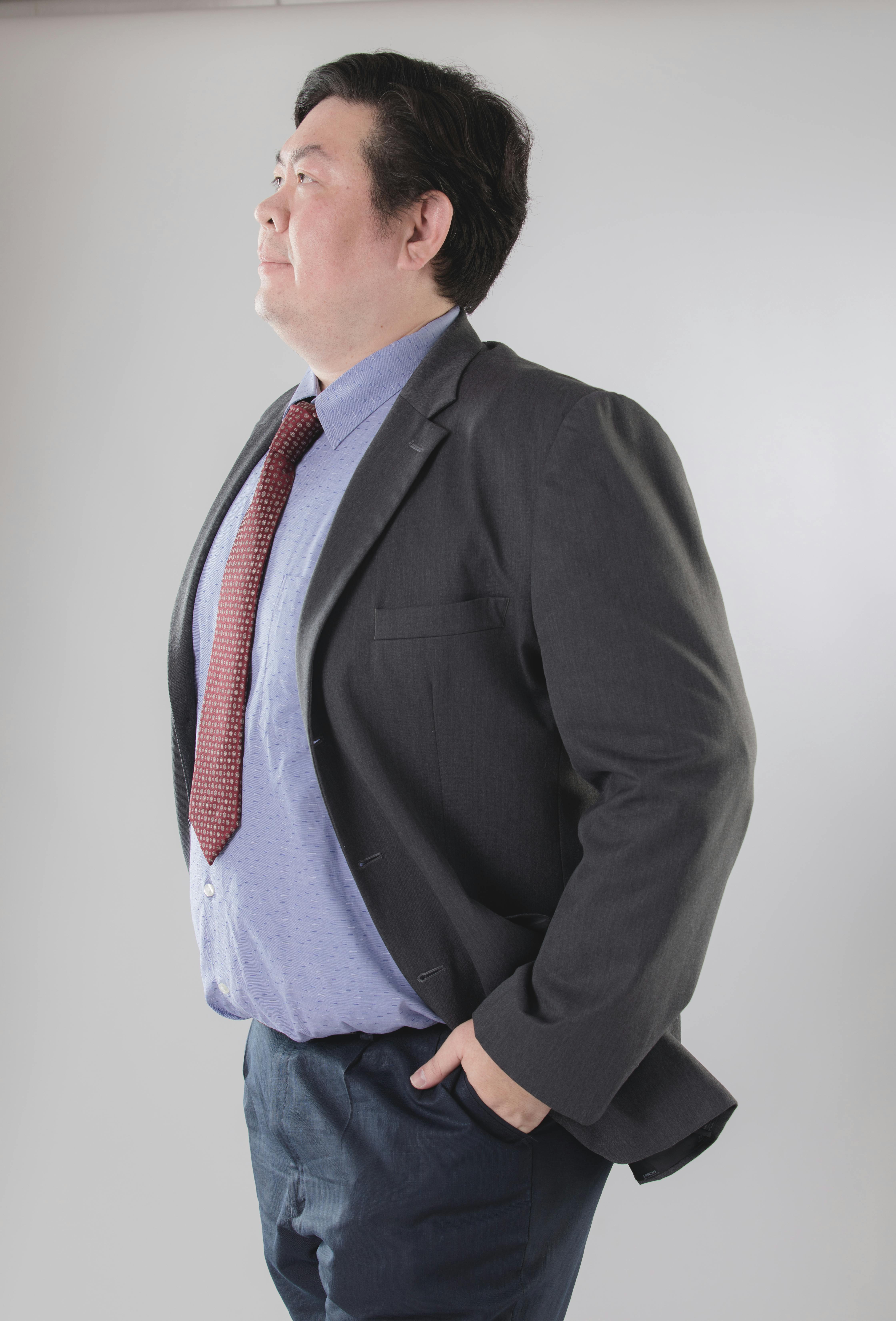Man Posing in Suit · Free Stock Photo
